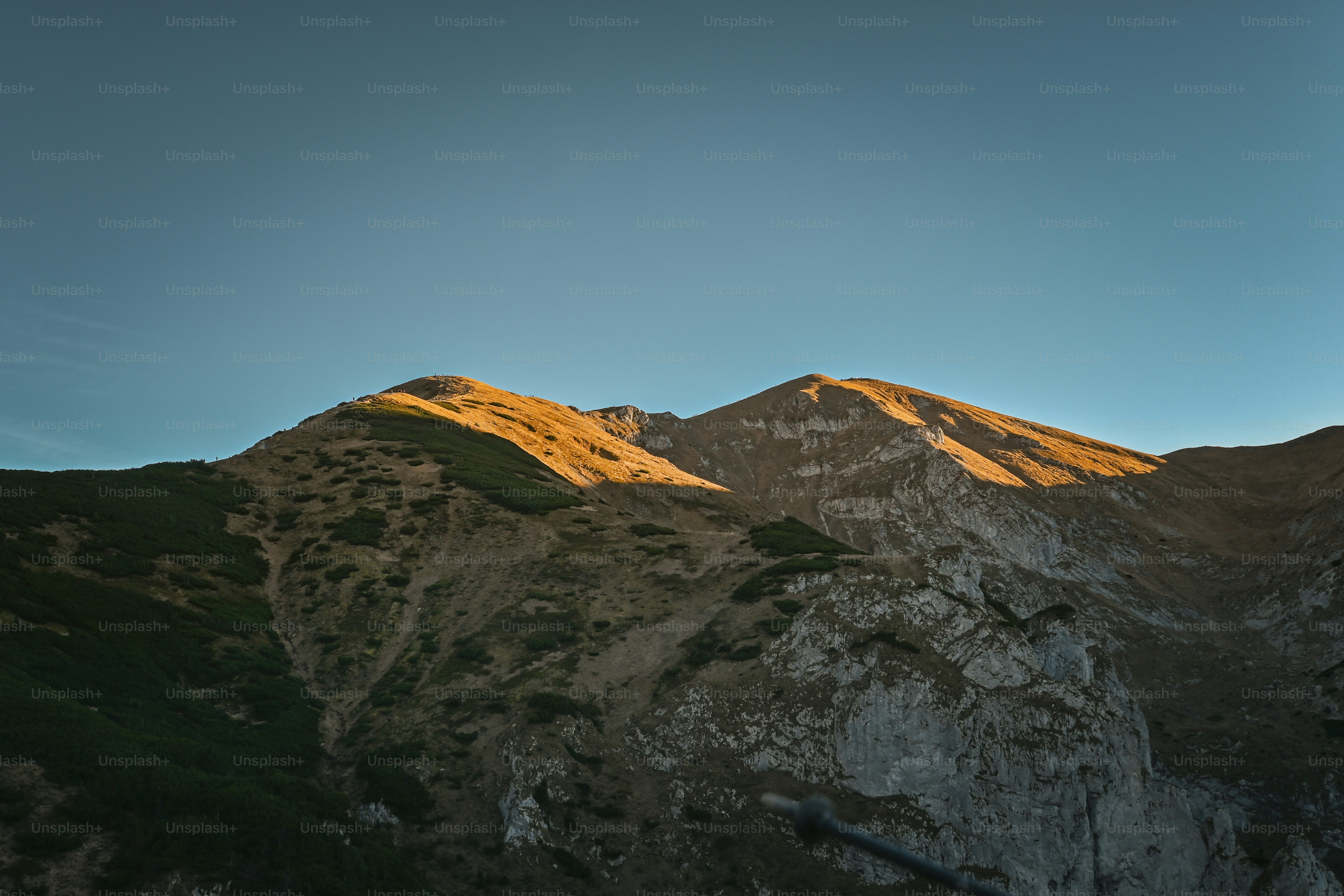 Sunlit mountain peaks against a clear blue sky photo – Scenery Image on ...