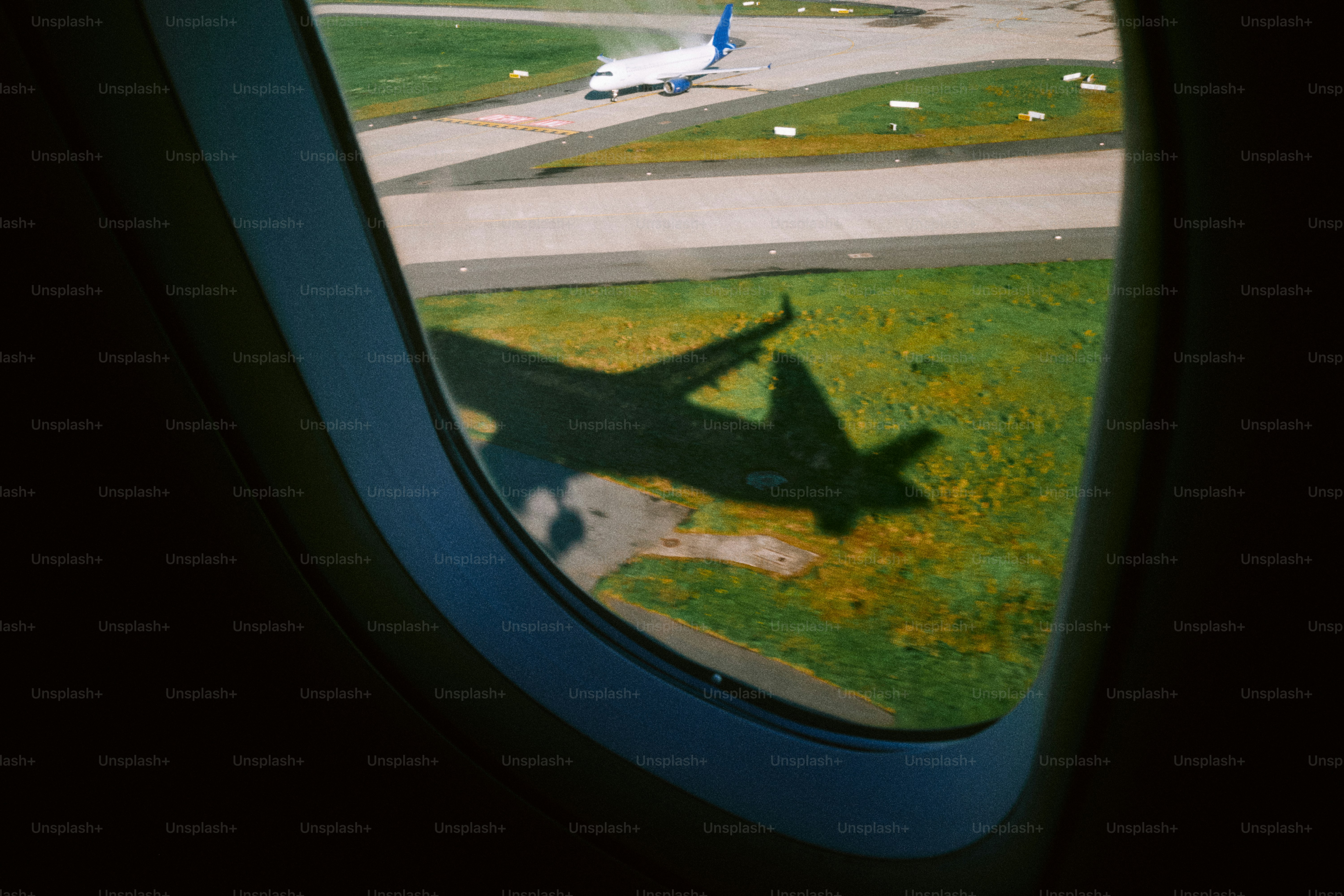 Airplane shadow on the ground from an airplane window photo – Travel ...