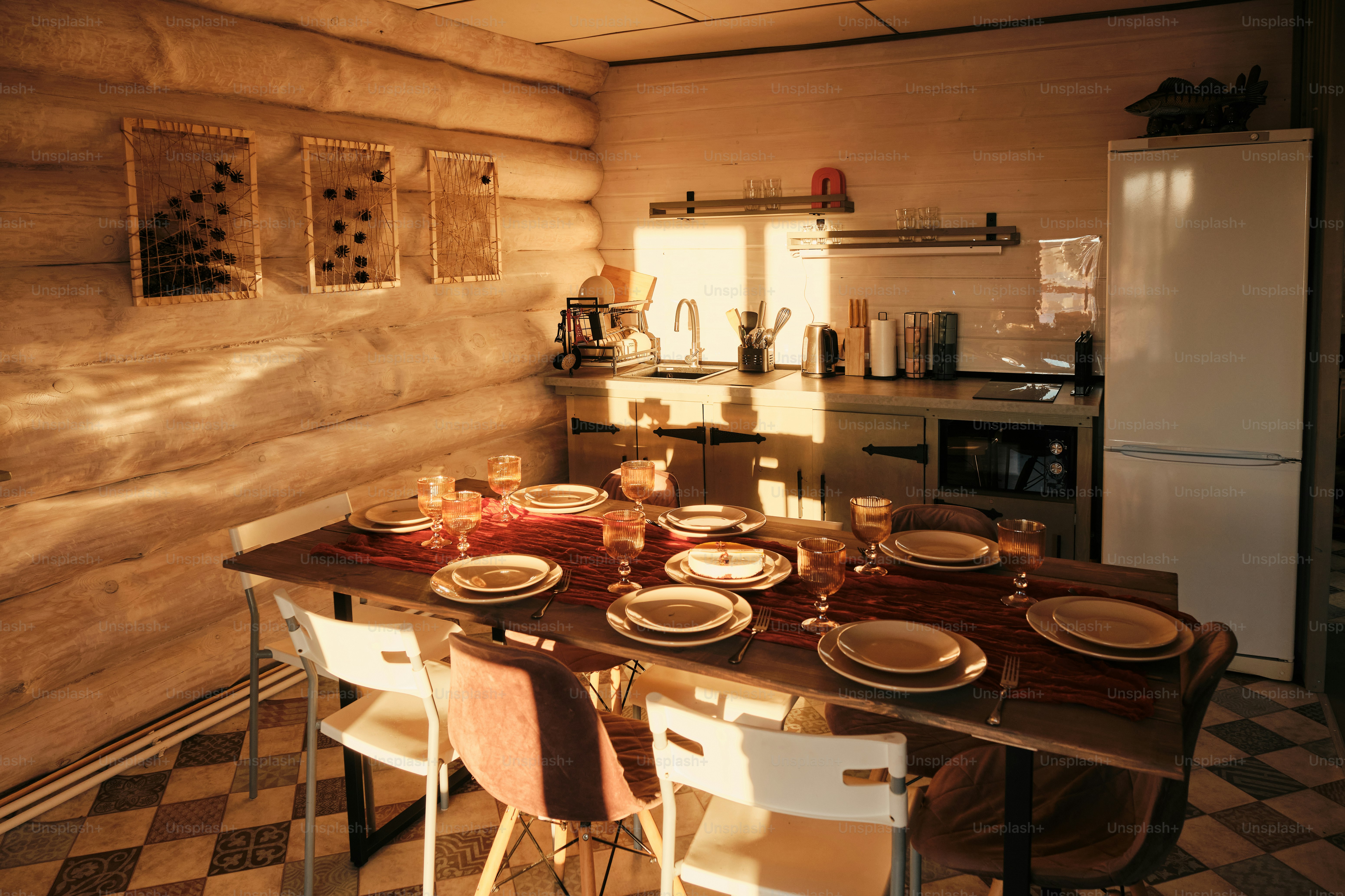Dining table set for a meal in a log cabin. photo – Winter Image on ...