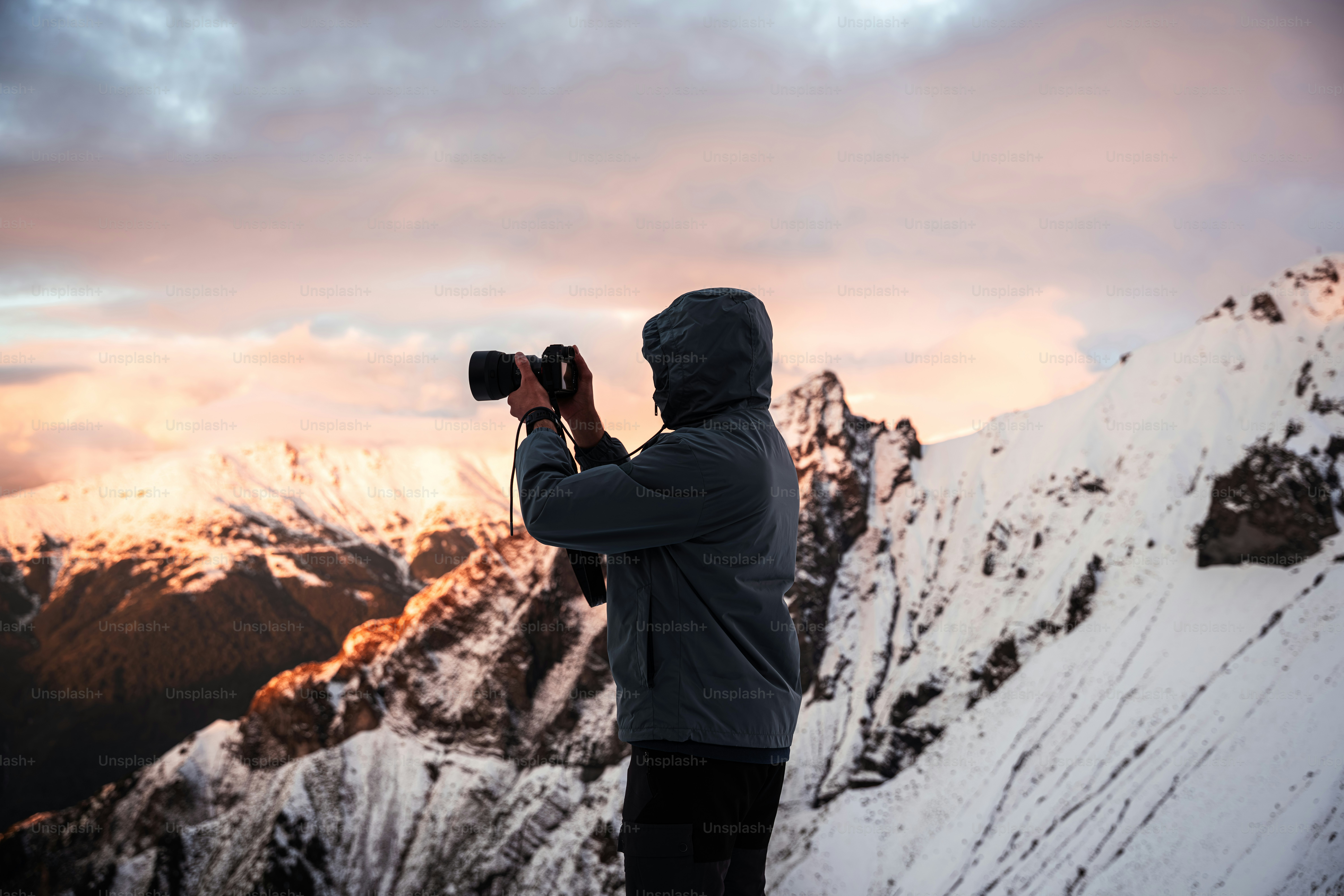 Two trucks driving on a snowy mountain road at sunset photo – Sunset ...