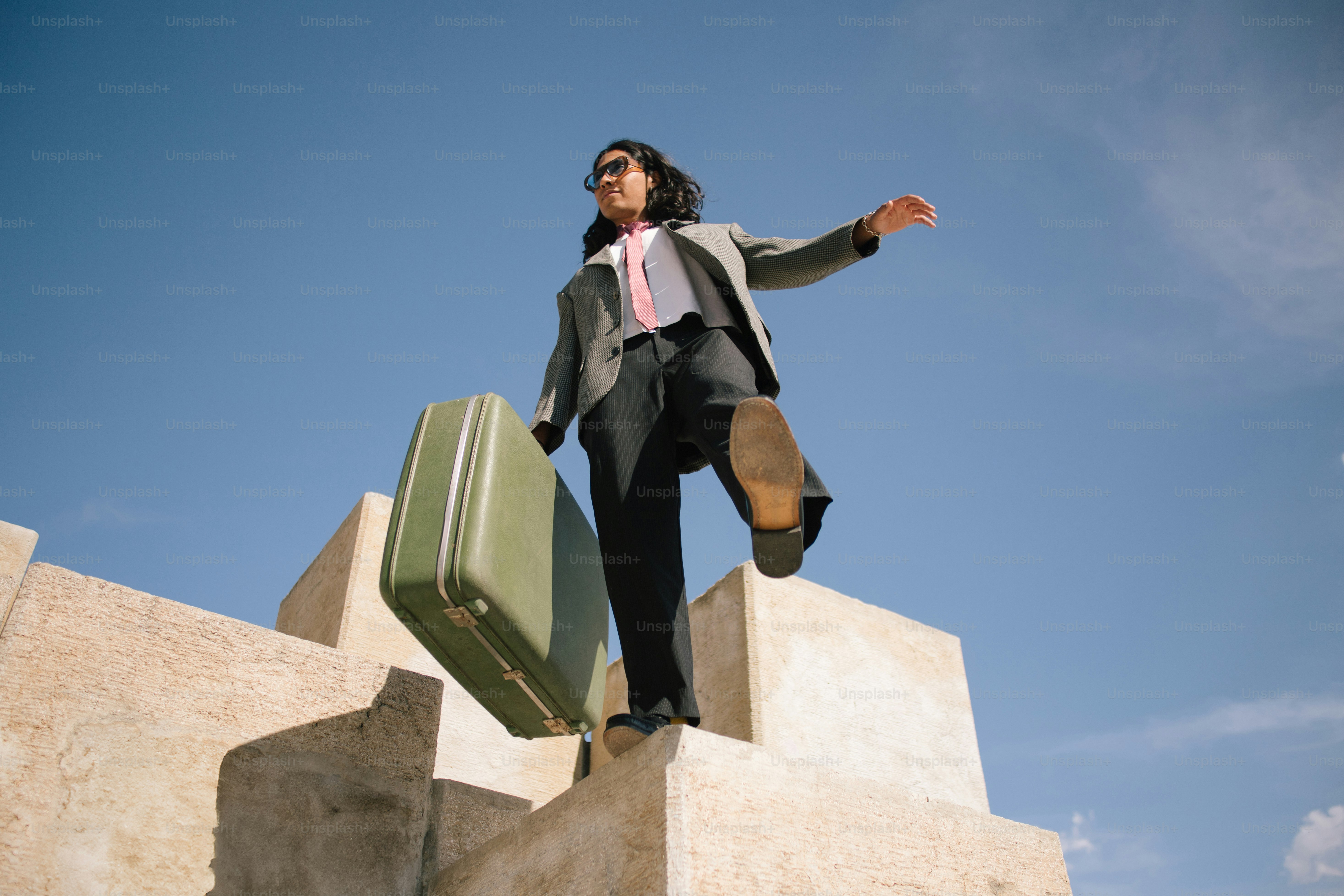 Woman with suitcase stands on tiled surface photo – Image on Unsplash