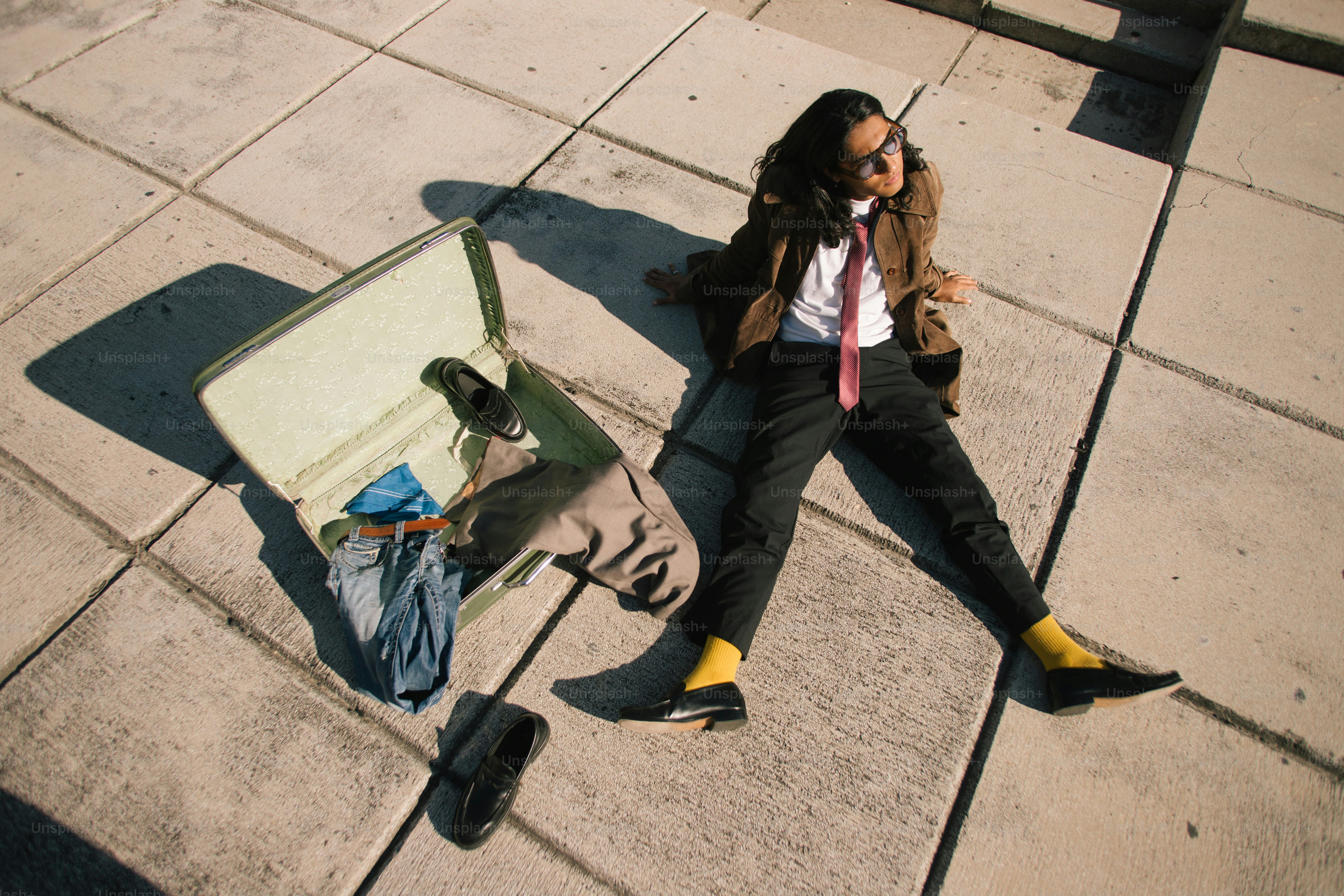 Woman with suitcase stands on tiled surface photo – Image on Unsplash
