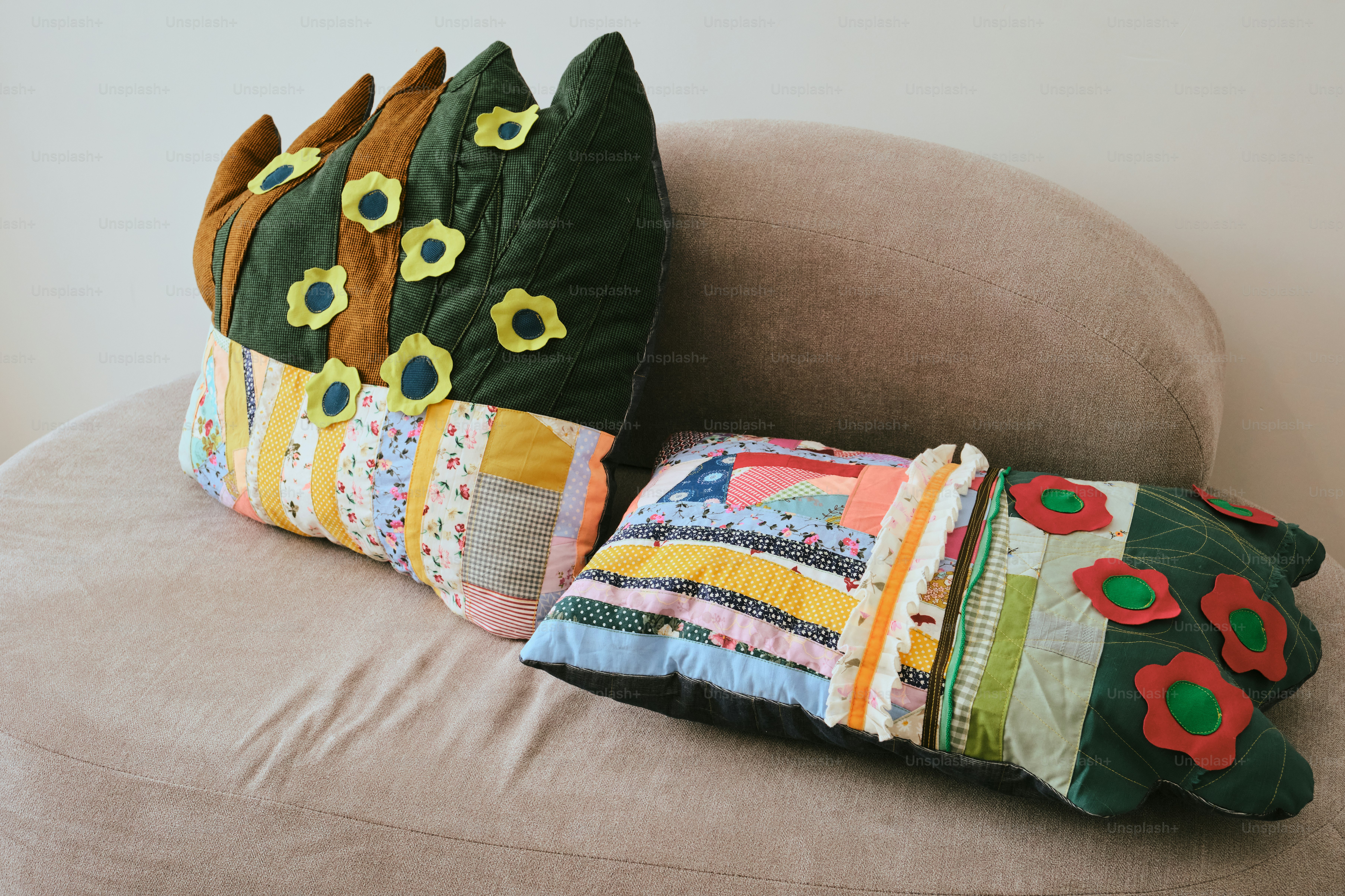 Two colorful handmade patchwork pillows on a sofa. photo – Woman Image ...