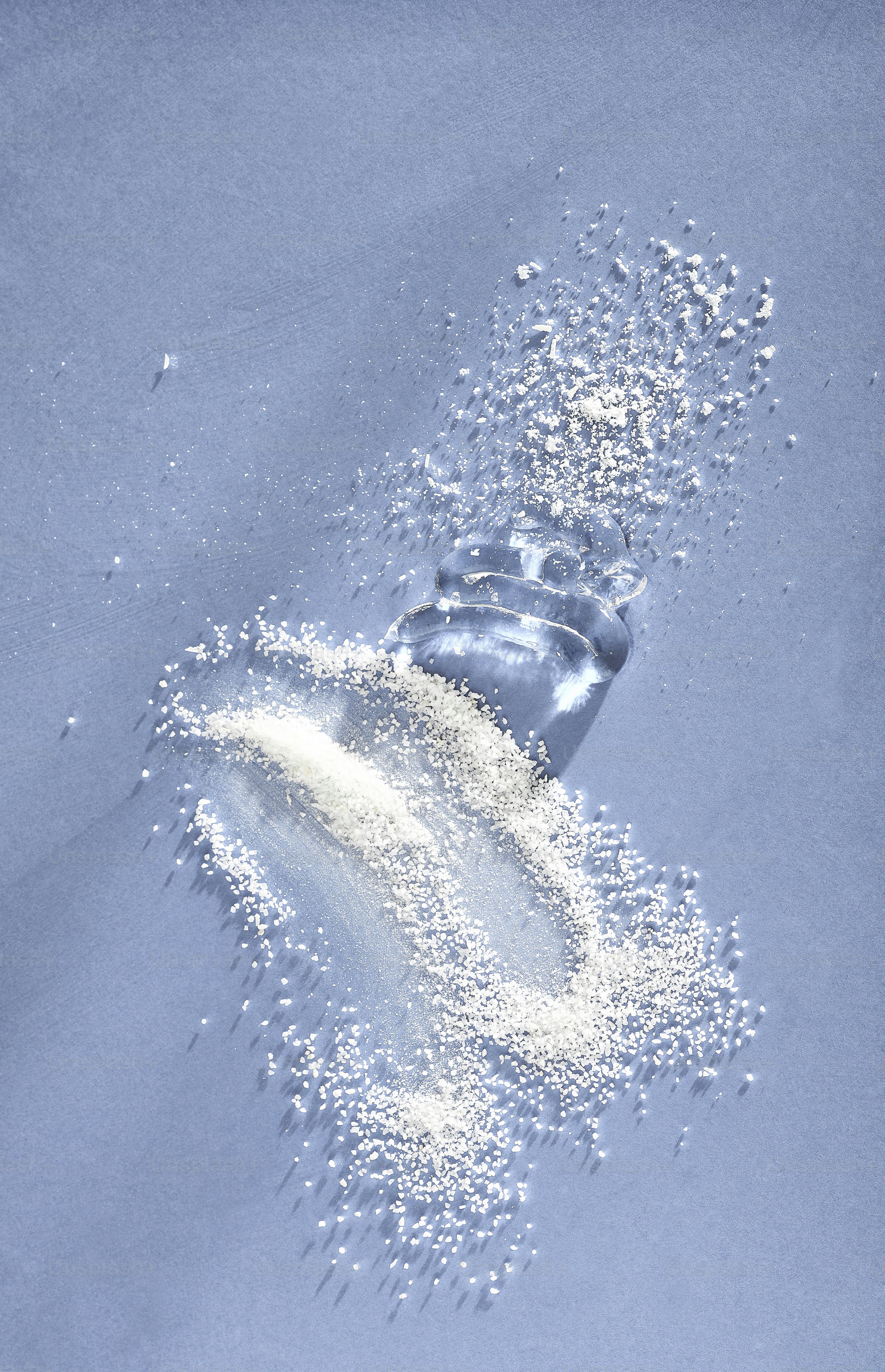 White powder spills from a clear glass bottle. photo – Texture Image on ...