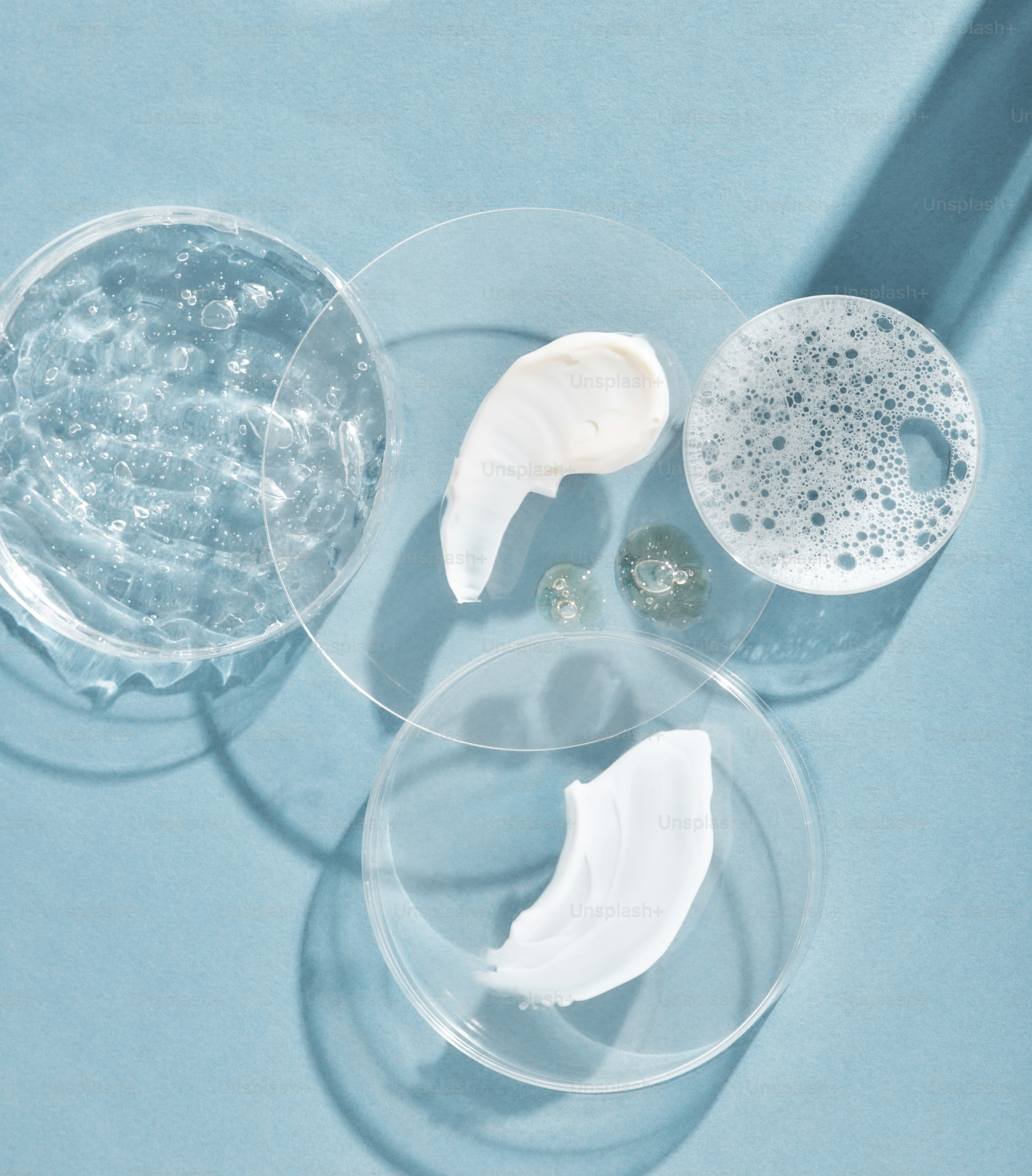White cream and clear liquids in lab dishes photo – Texture Image on ...