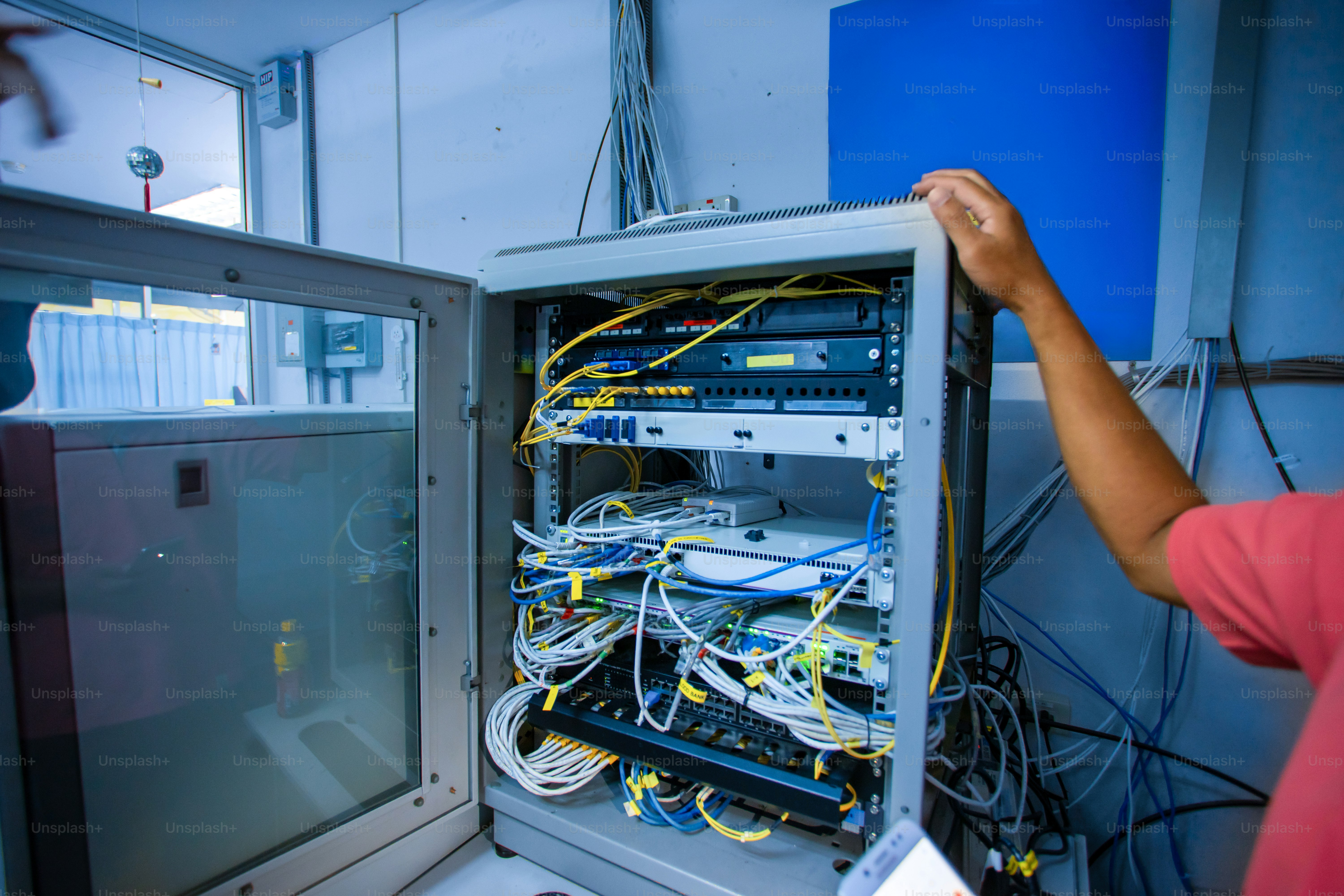 A detailed view of network equipment organized within a server room ...