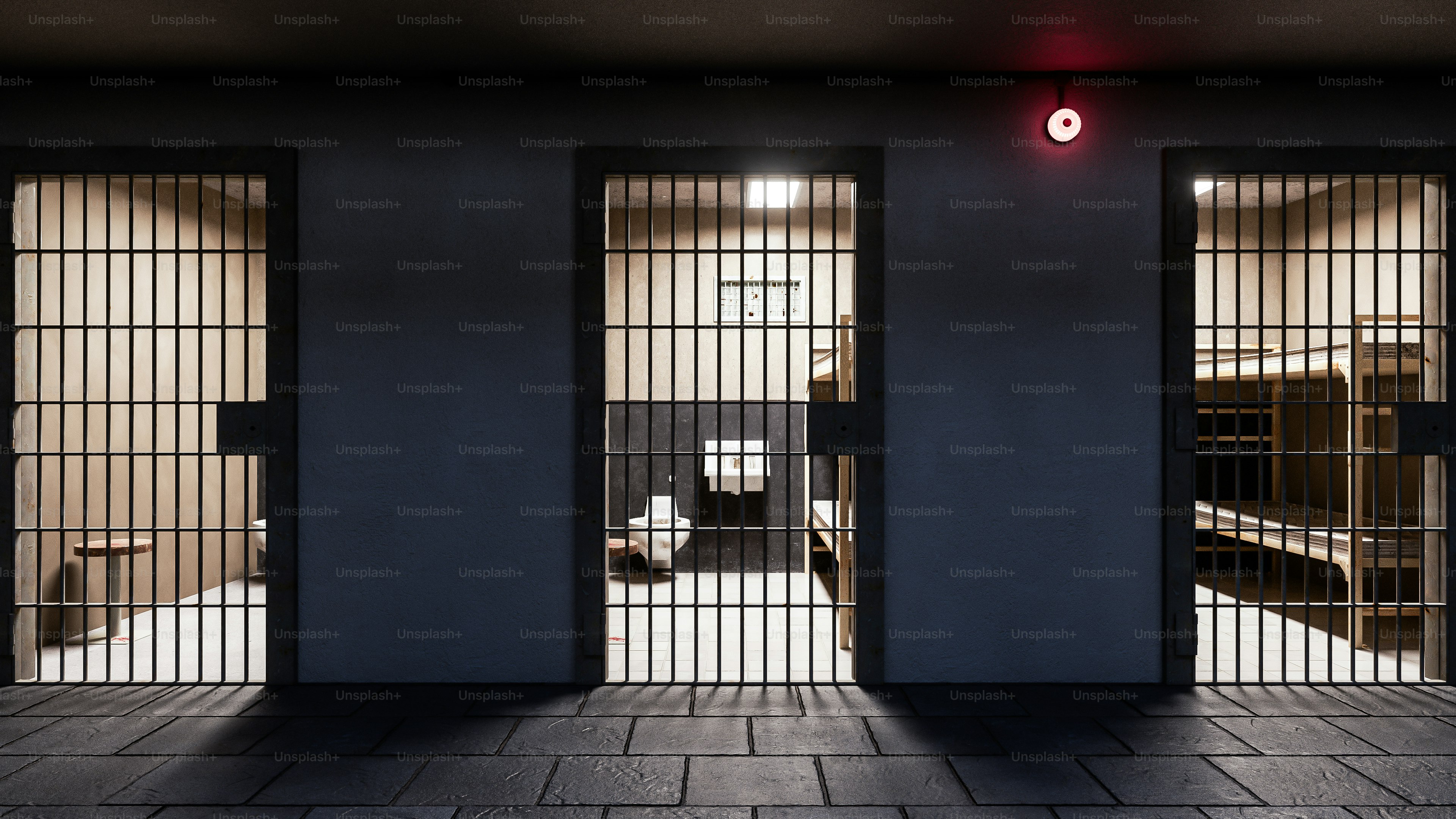 Three jail cells with barred doors and beds. photo – Security Image on ...