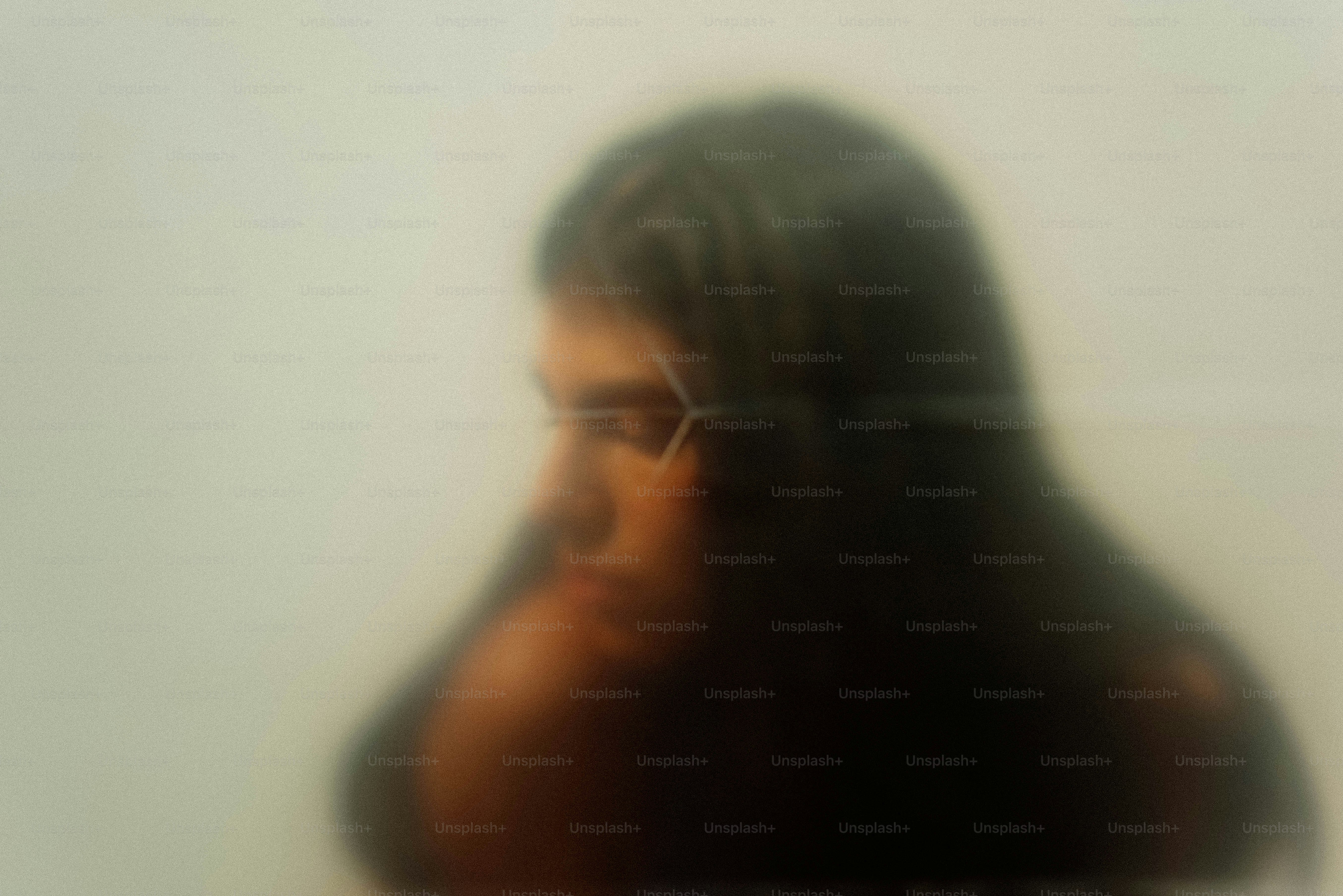 A blurred profile of a person wearing glasses. photo – Portrait Image ...