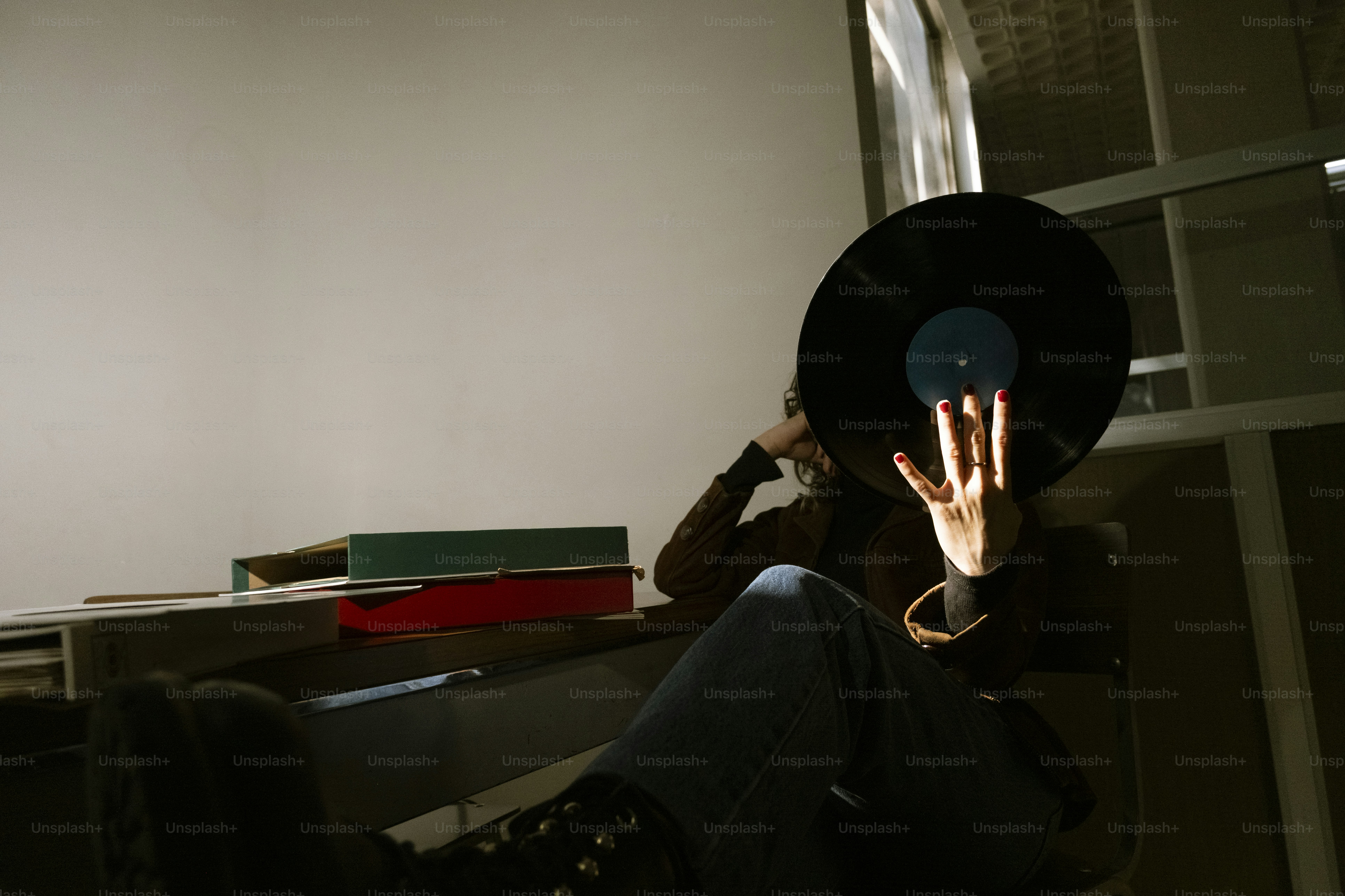 Person holding a vinyl record in front of face photo – Music Image on ...