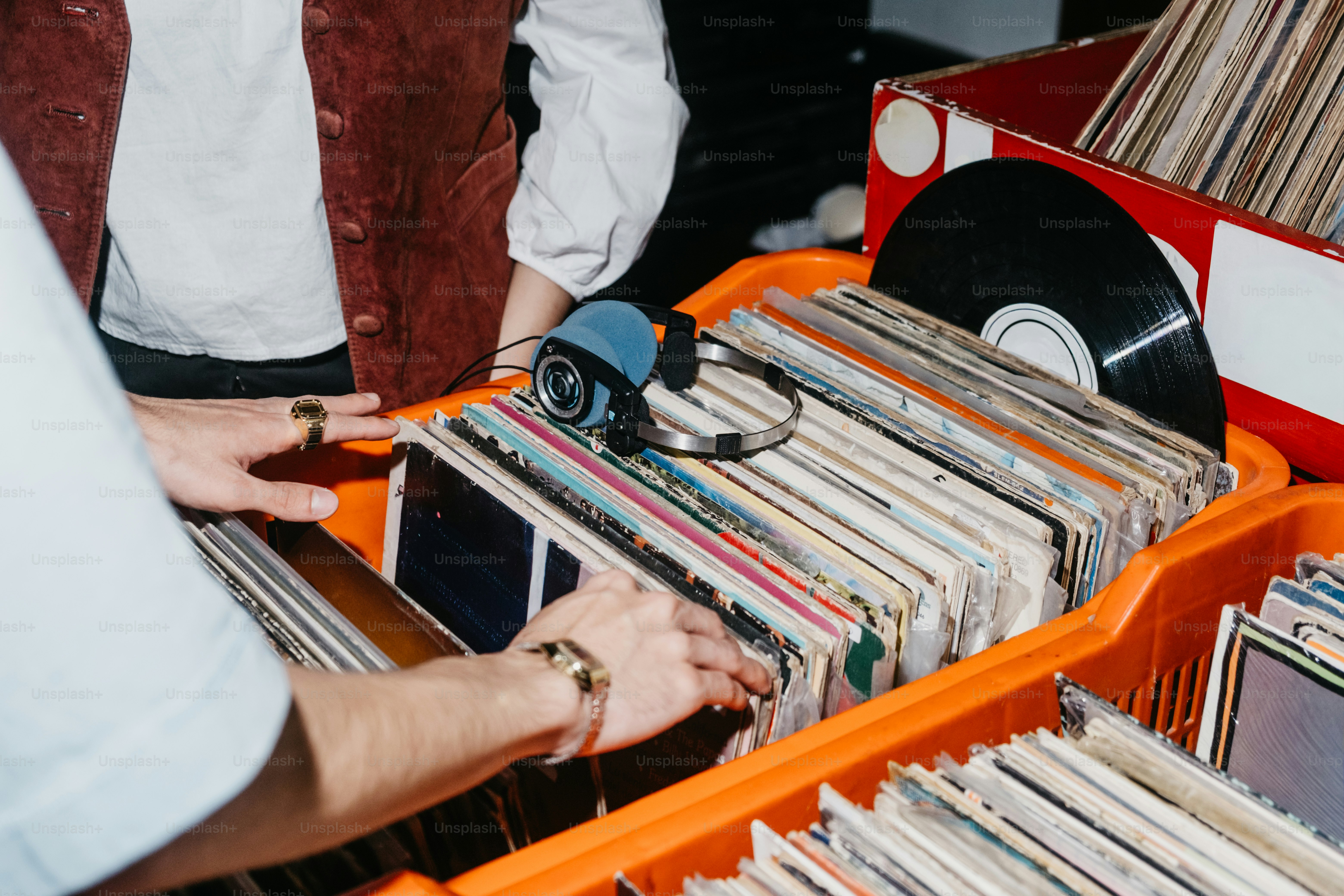 Person sifting through vinyl records in a crate photo – Nostalgia Image ...