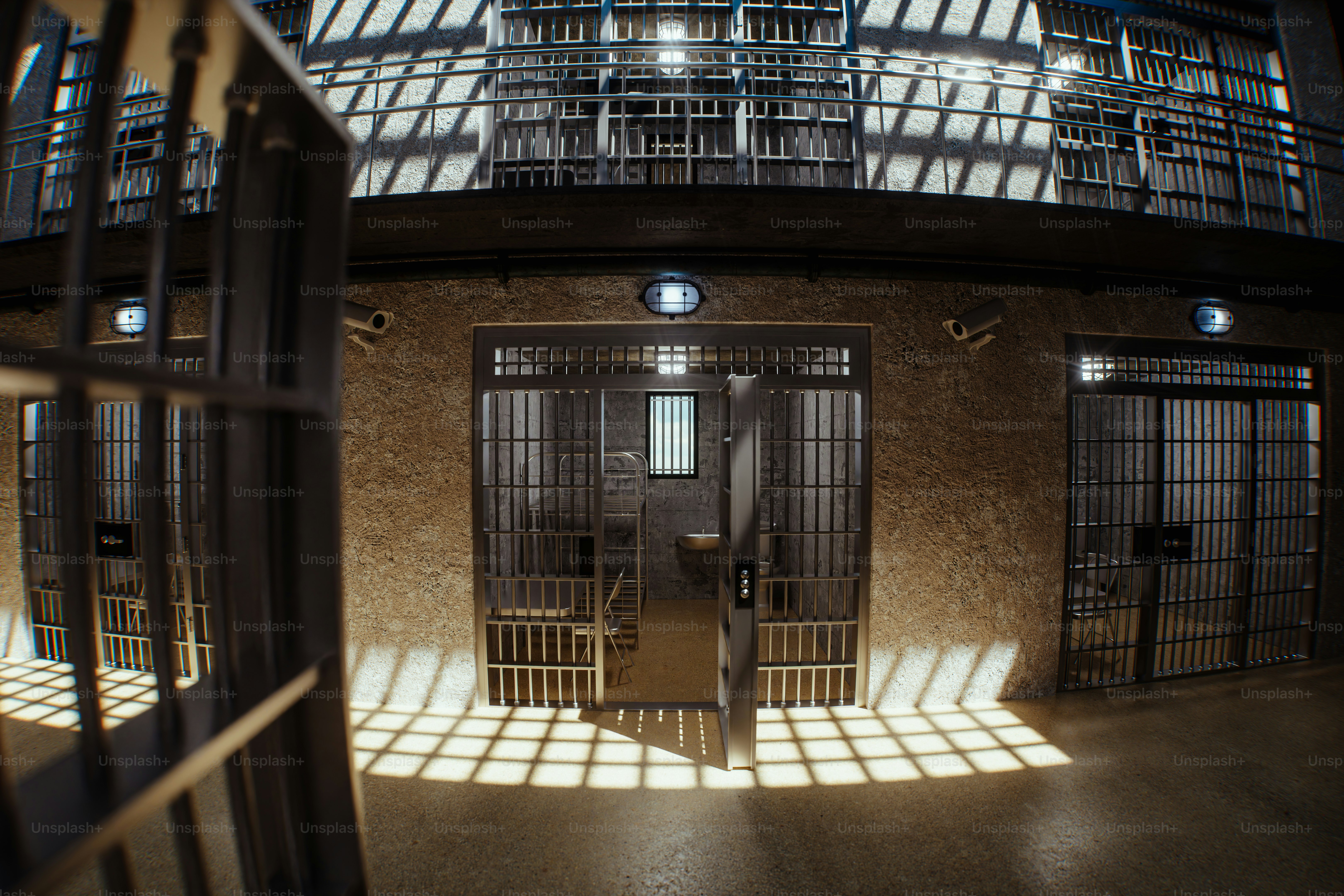 A small, sparse jail cell with bunk beds and toilet. photo – Wallpaper ...