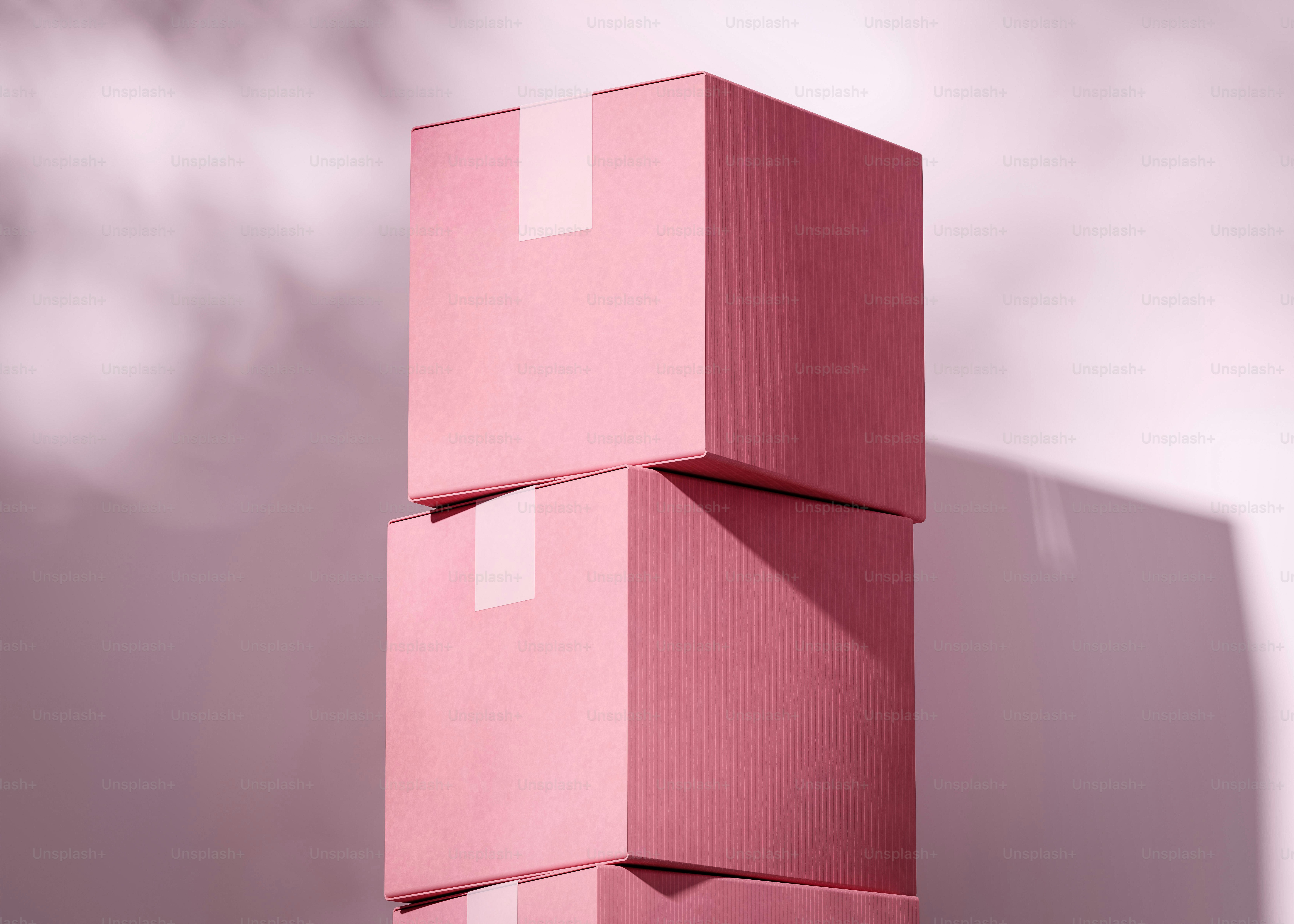 Stack of three pink cardboard boxes photo – Logistics Image on Unsplash