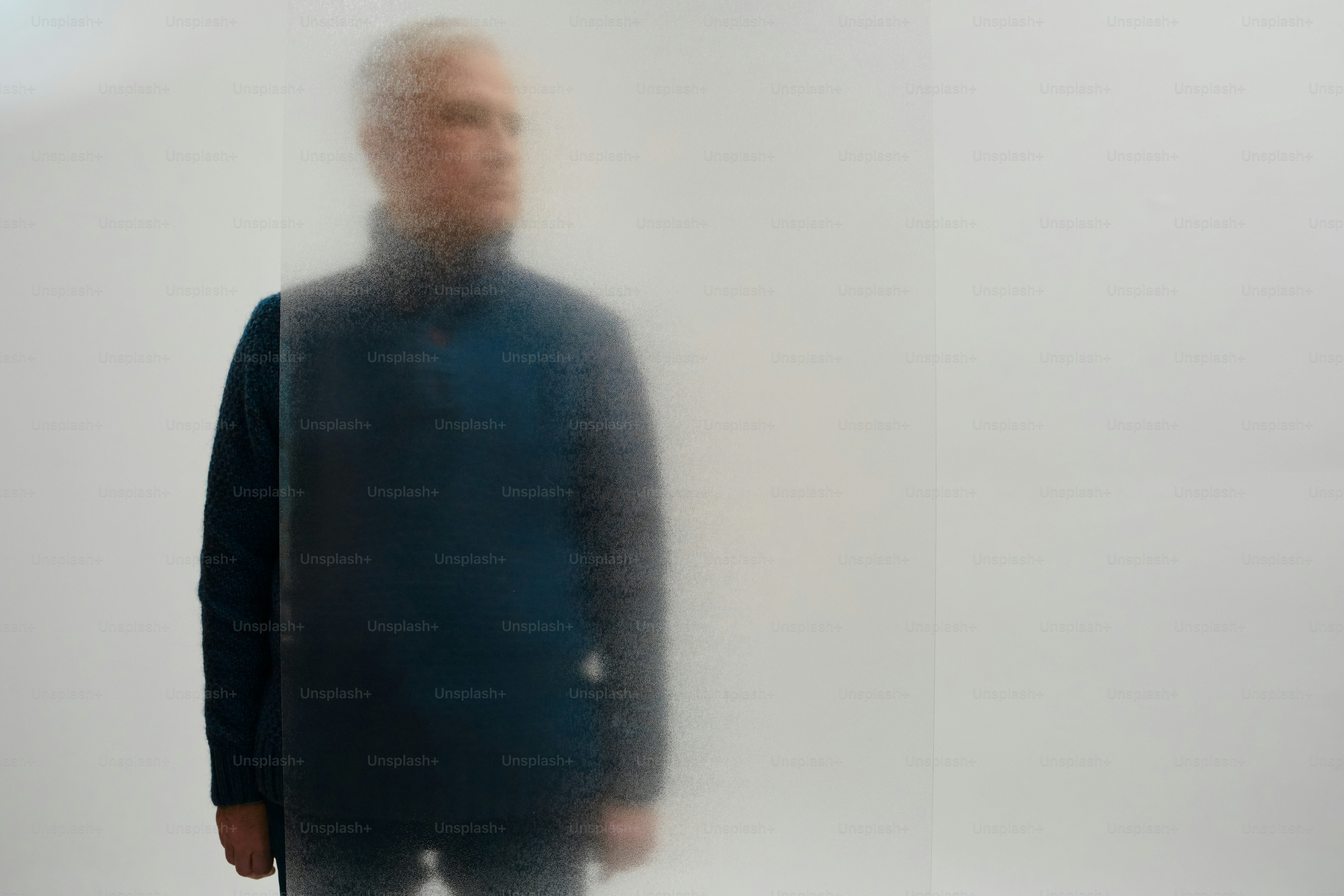 Man behind frosted glass with hand to ear photo – Portrait Image on ...