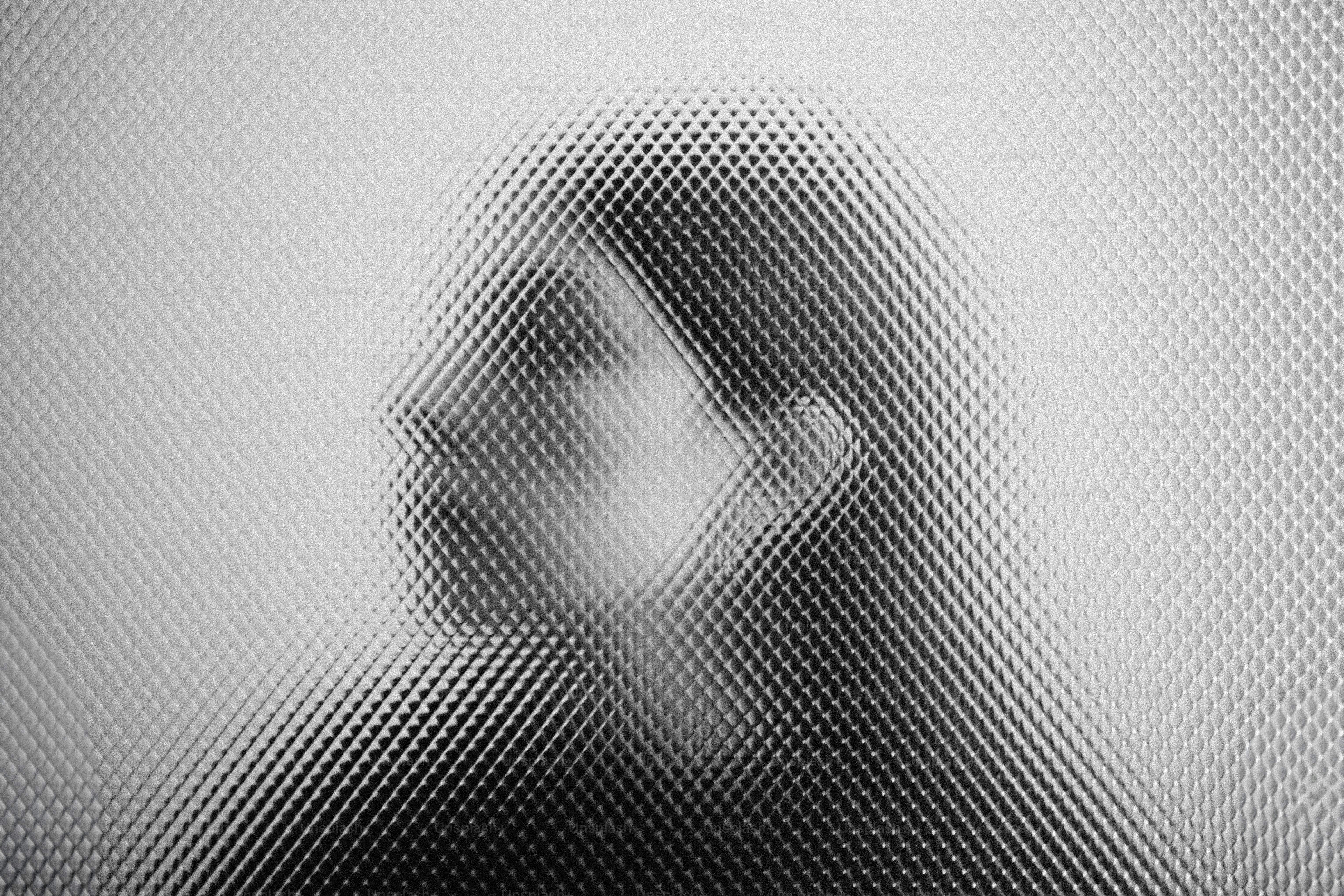 Blurred profile of a person seen through textured glass. photo ...