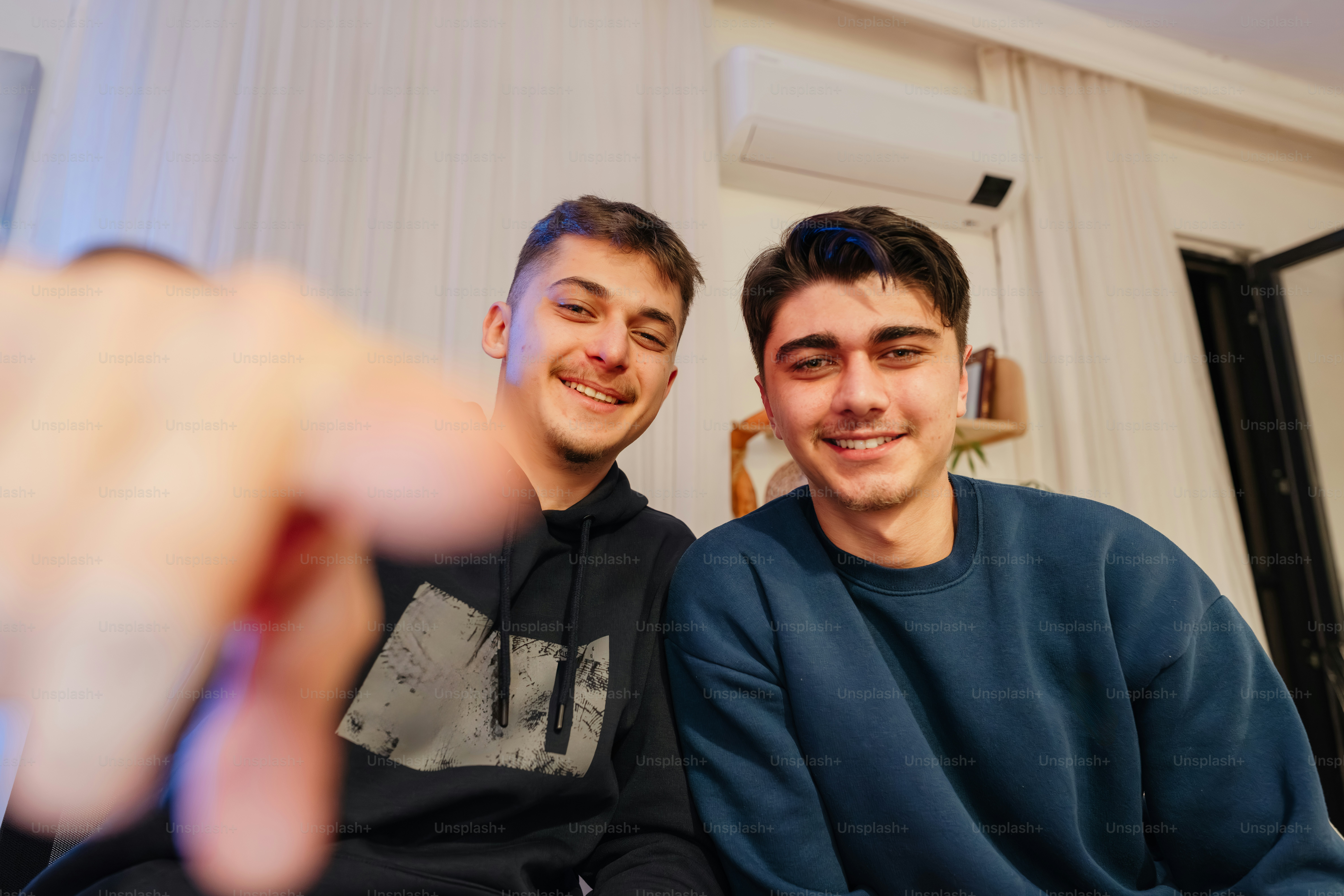Two young men smiling at the camera photo – Portrait Image on Unsplash