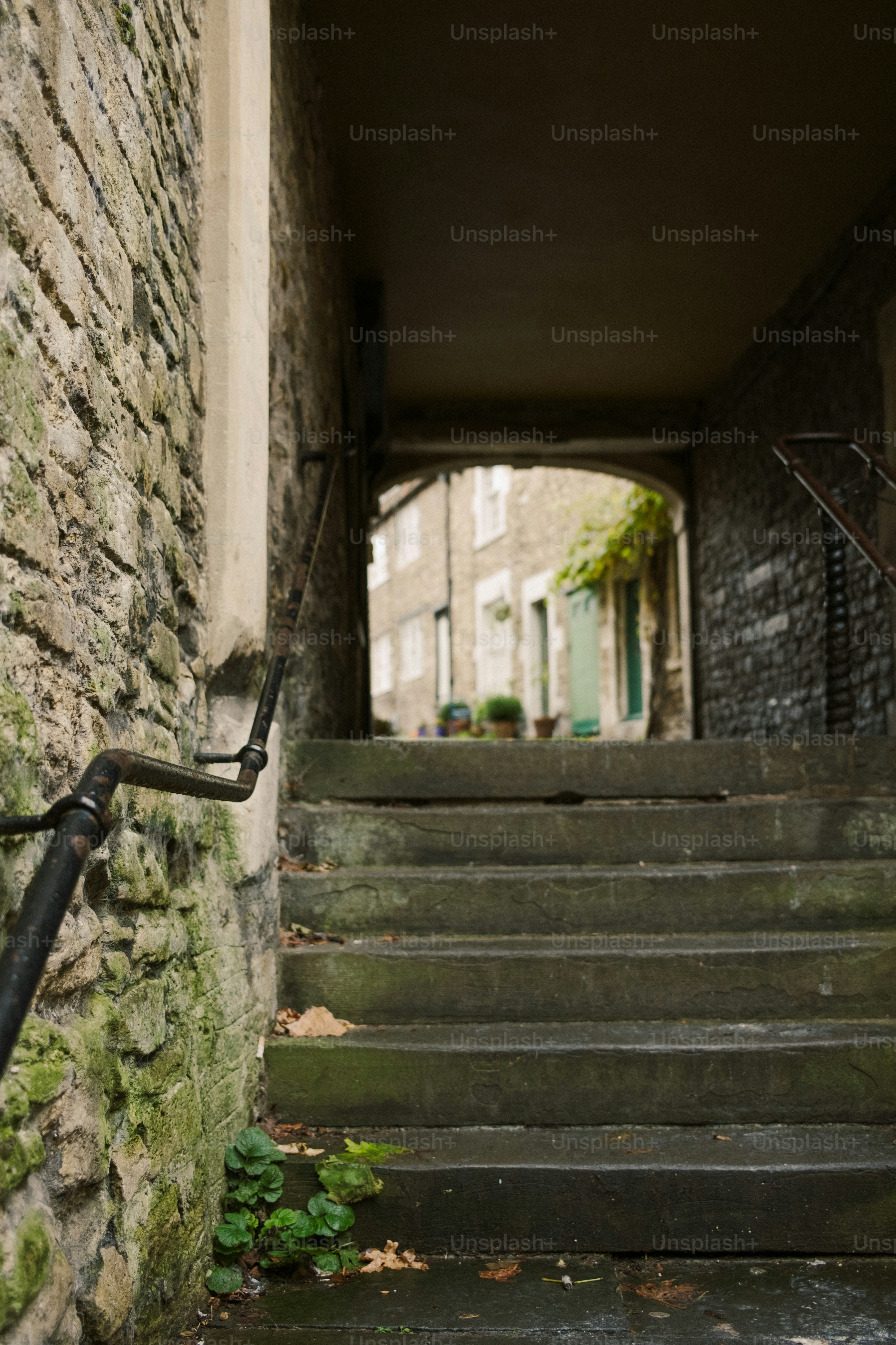 Stone steps lead through an archway to a street. photo – Vintage Image ...