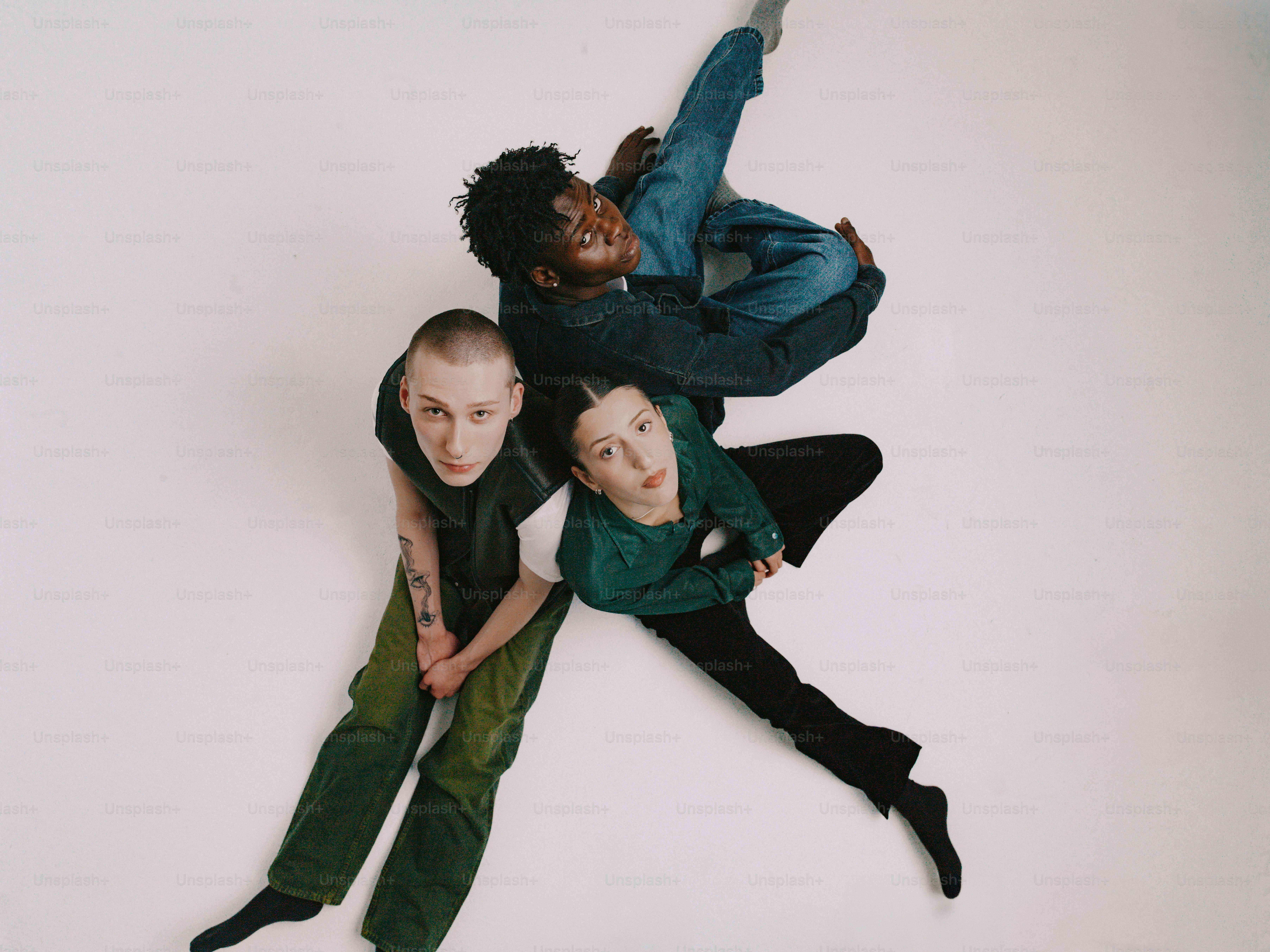 Three people looking up against a white background photo – Portrait ...