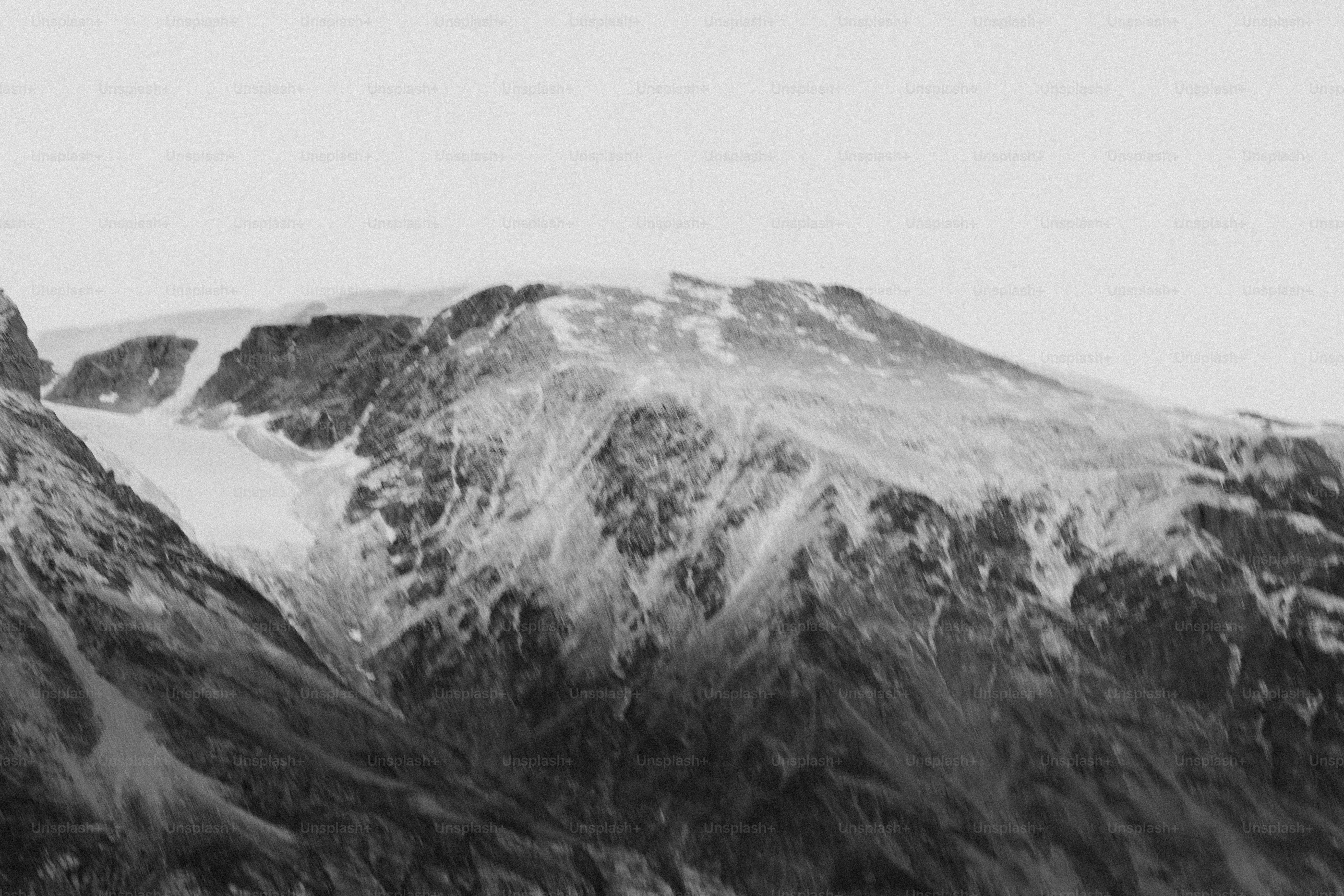 Snow covered mountain peak with rocky slopes photo – Mountains Image on ...