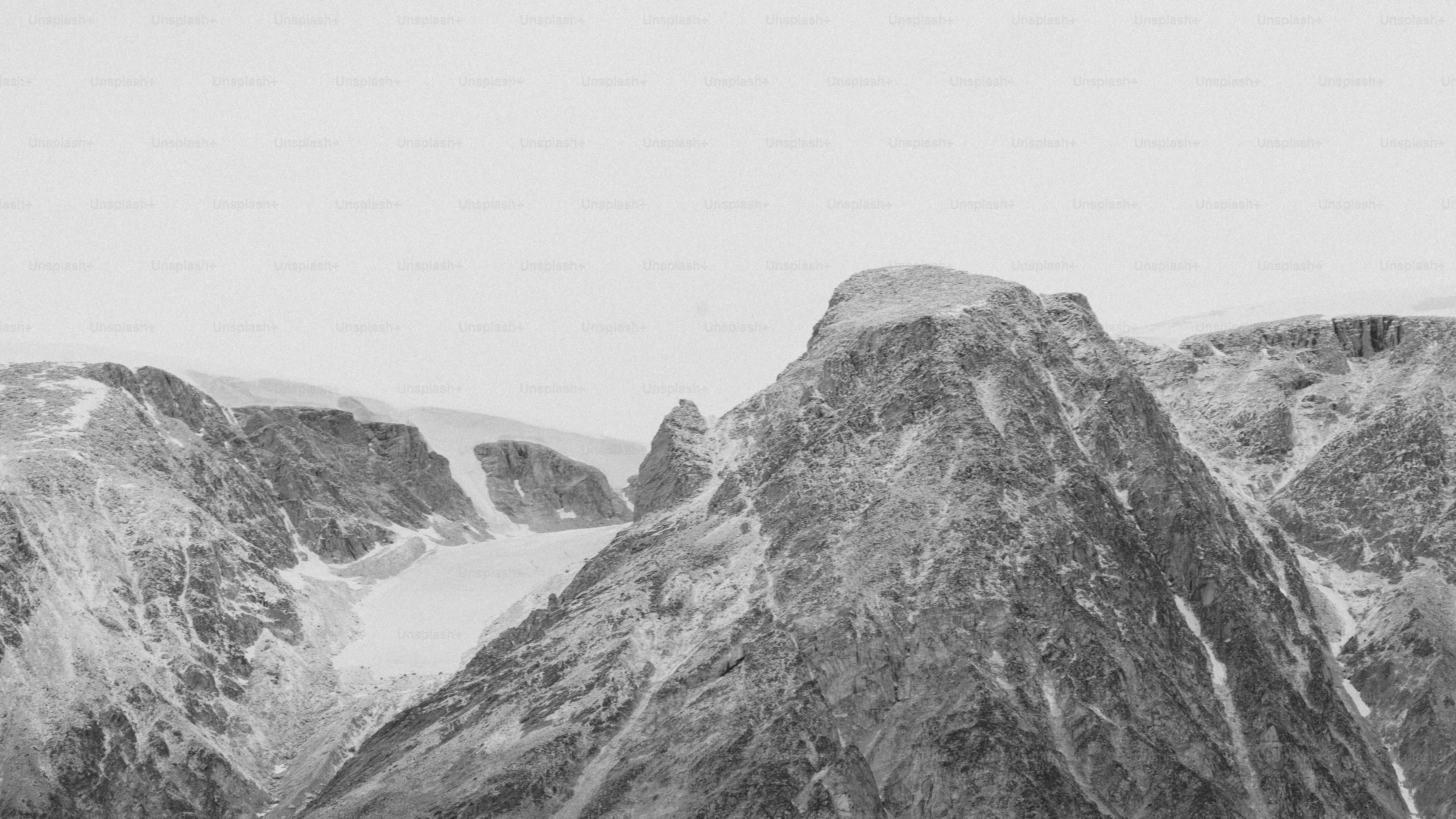 Snow covered mountain peak with rocky slopes photo – Mountains Image on ...