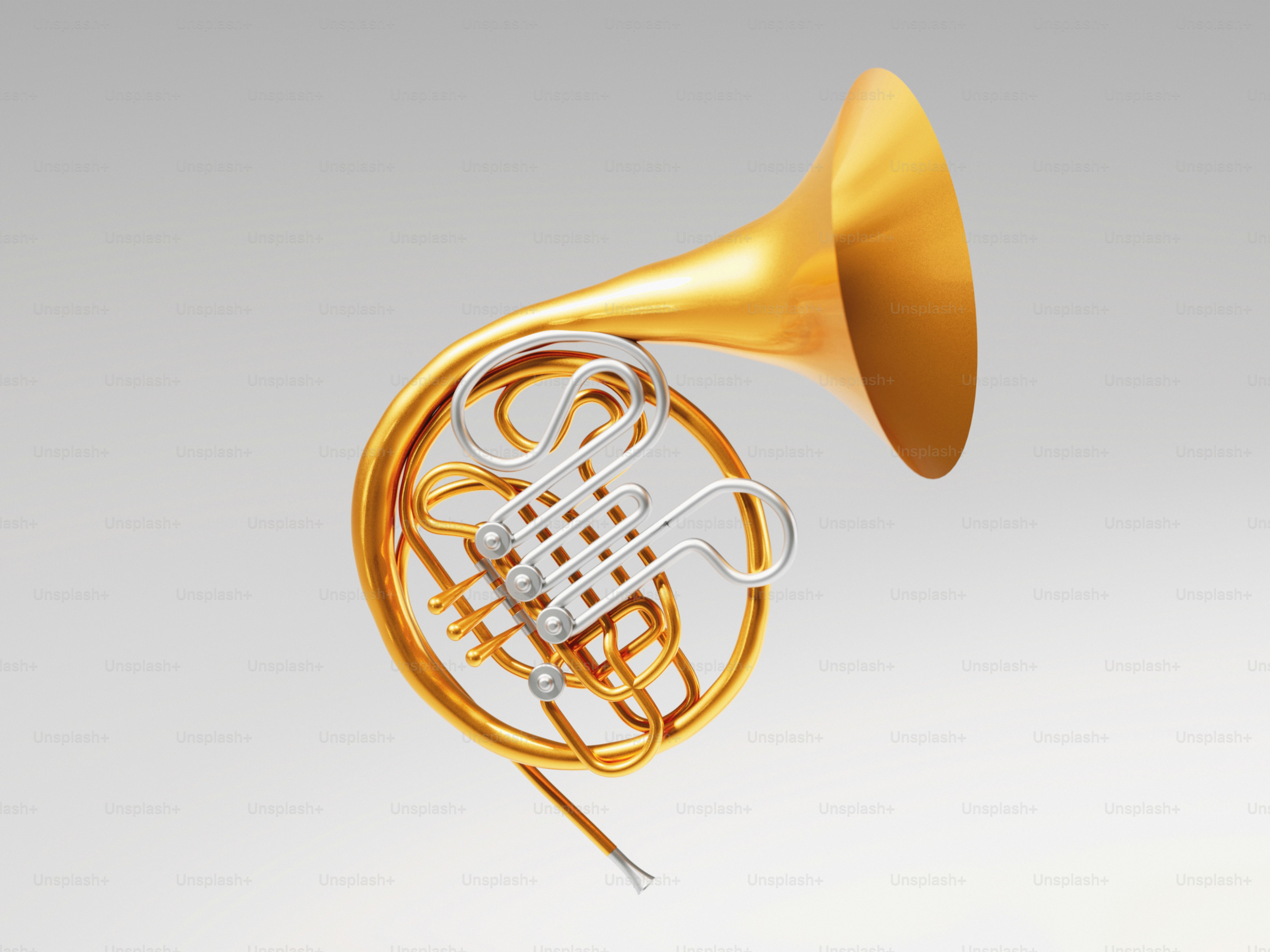 A golden french horn on a grey background photo – Music Image on Unsplash
