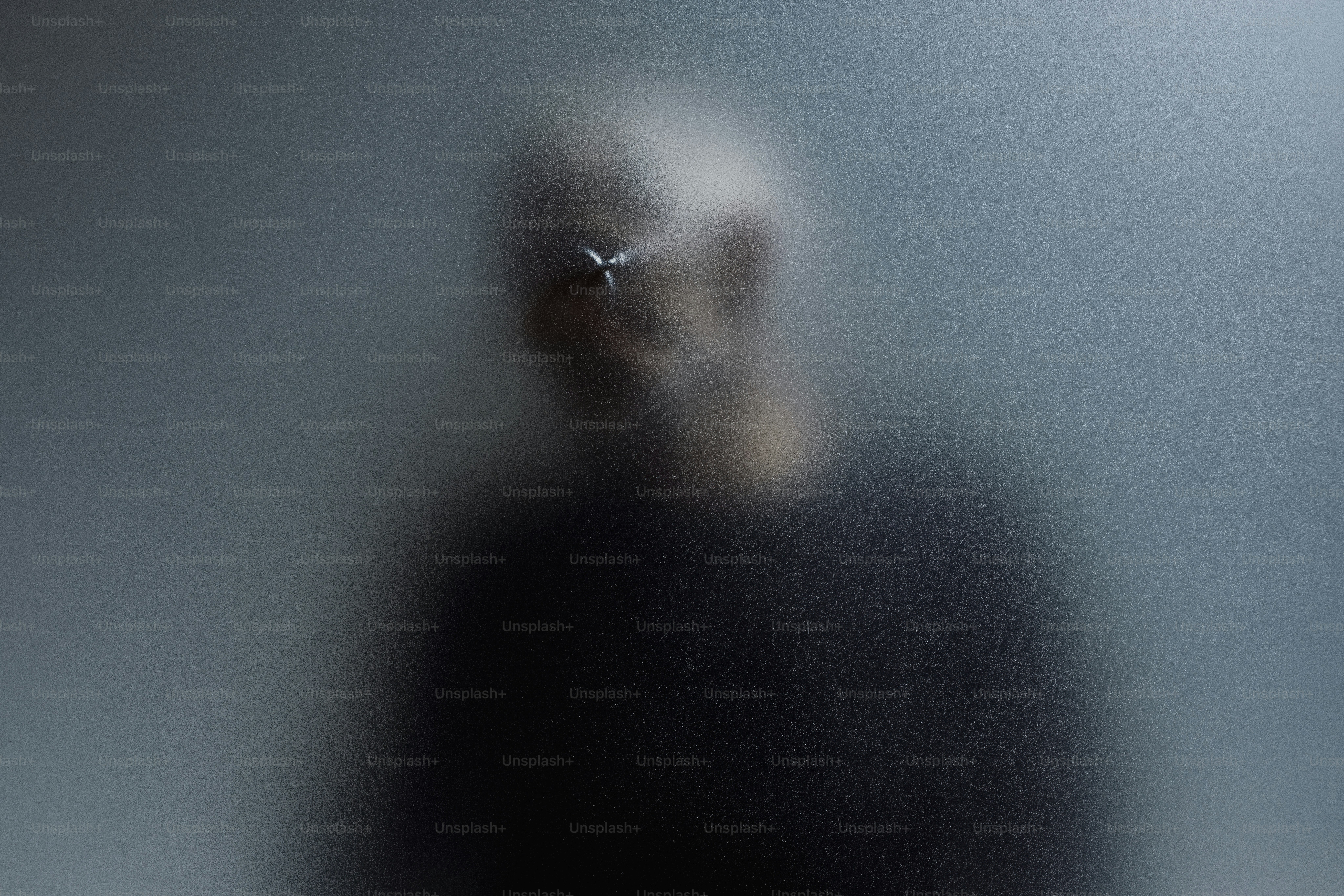 Blurred figure seen through frosted glass photo – Silhouette Image on ...