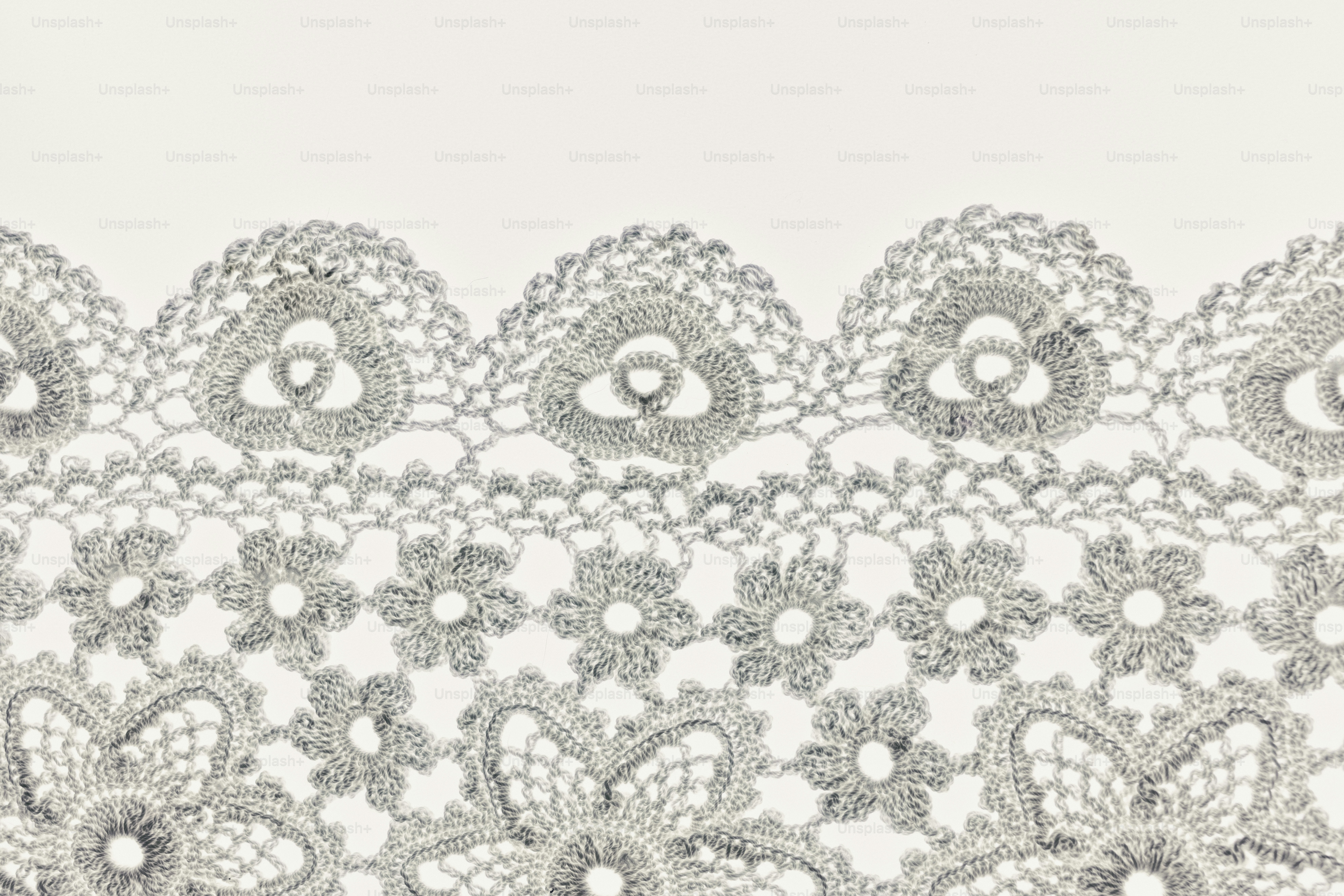 Intricate grey crochet lace with floral patterns photo – Textile Image ...