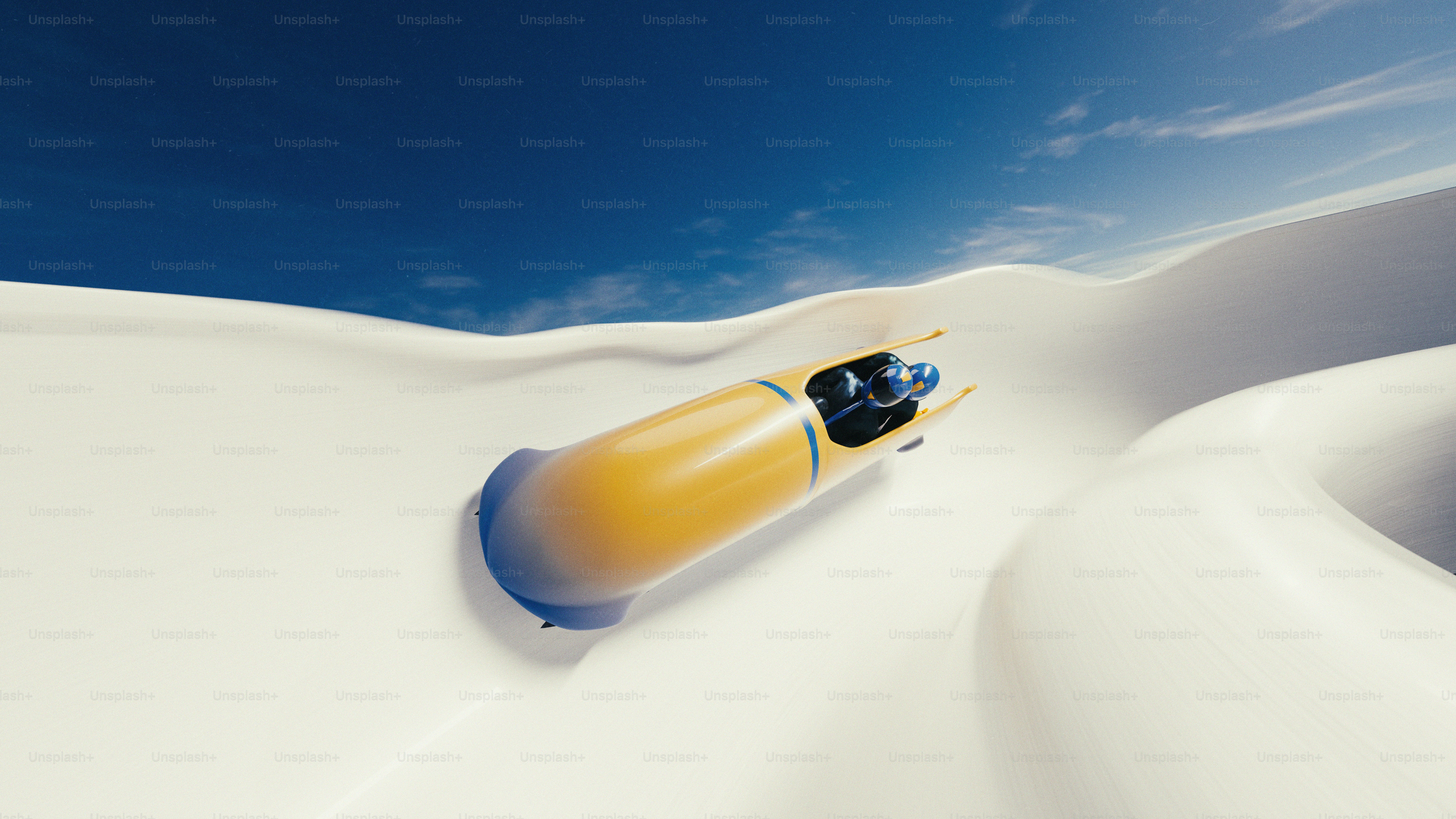 Bobsled speeding down a white track under blue sky photo – Winter Image ...