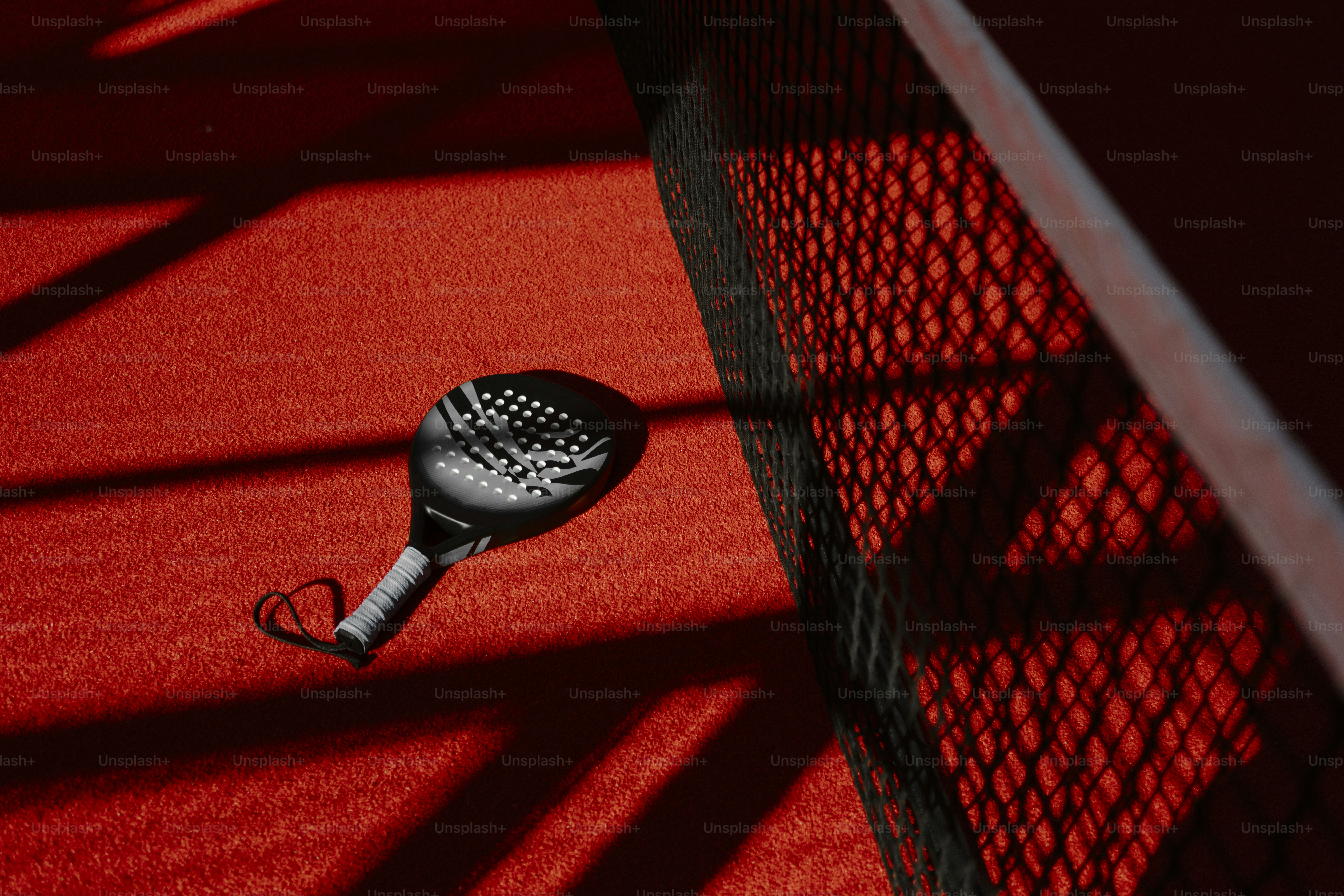Red sports court seen through a wire fence. photo – Fitness Image on ...