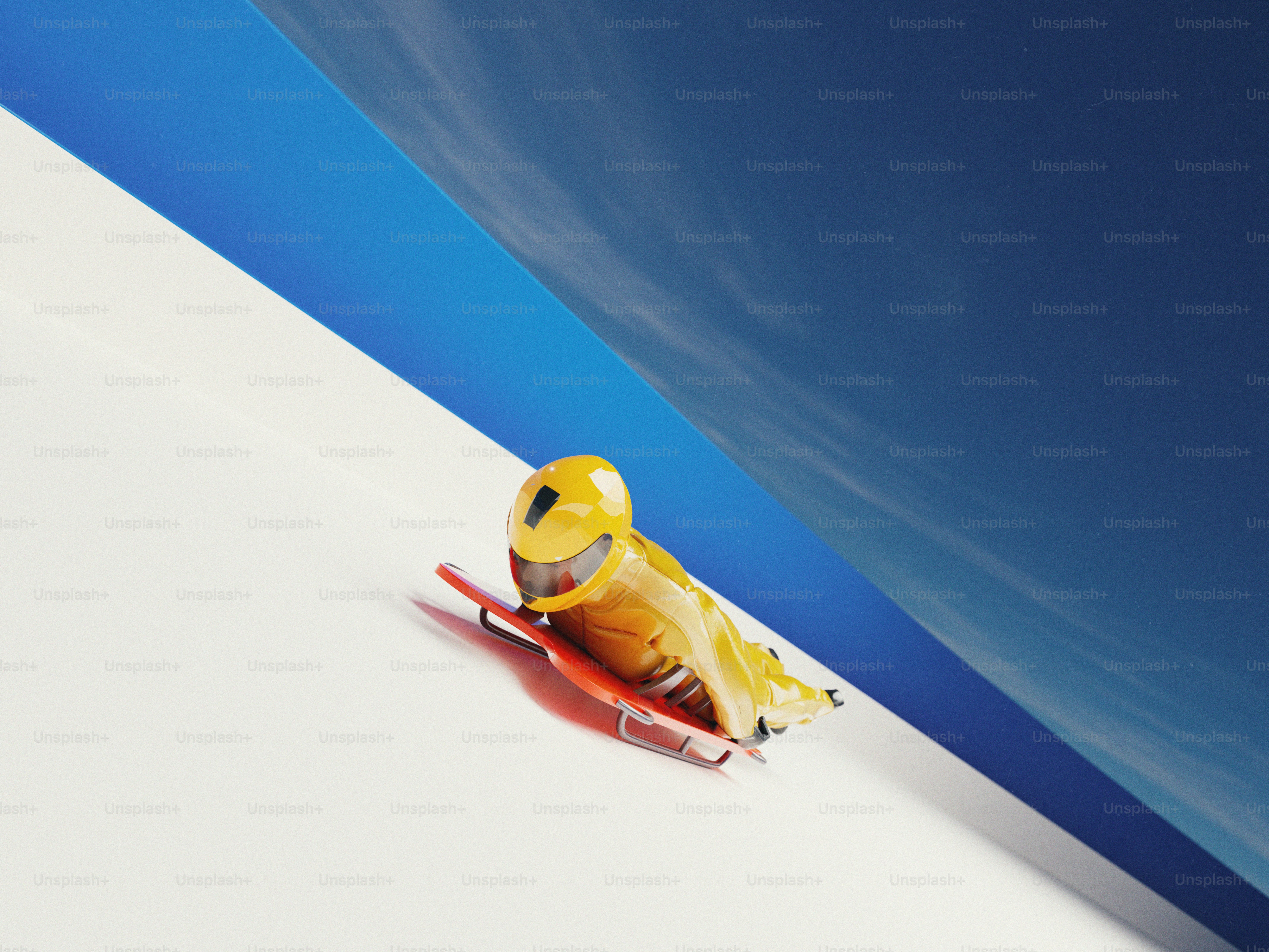 A yellow character on a sled goes down a slope photo – Sports Image on ...