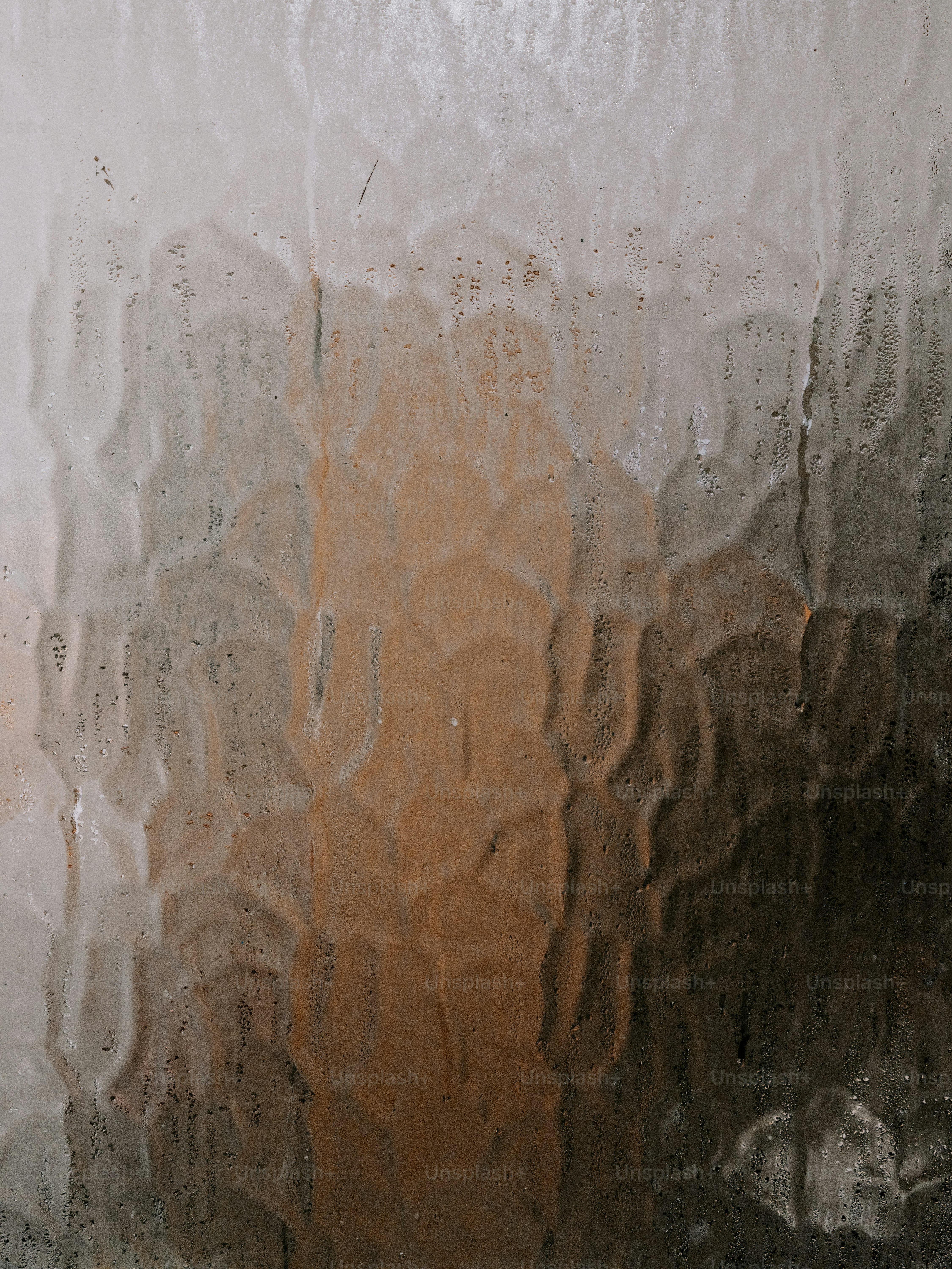 Textured glass with blurred abstract shapes and organic shapes. photo ...
