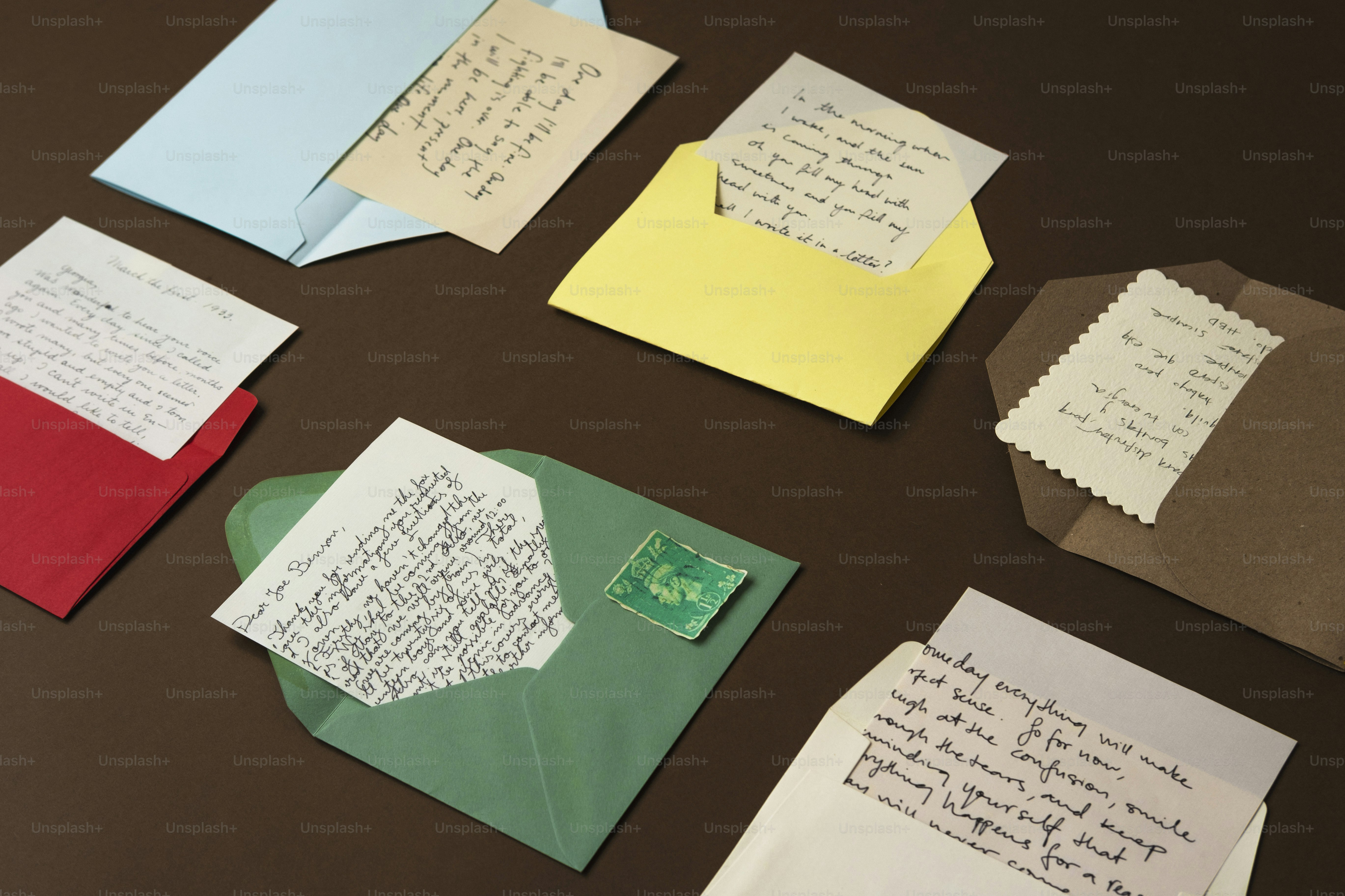 Several colorful envelopes with handwritten letters inside photo ...