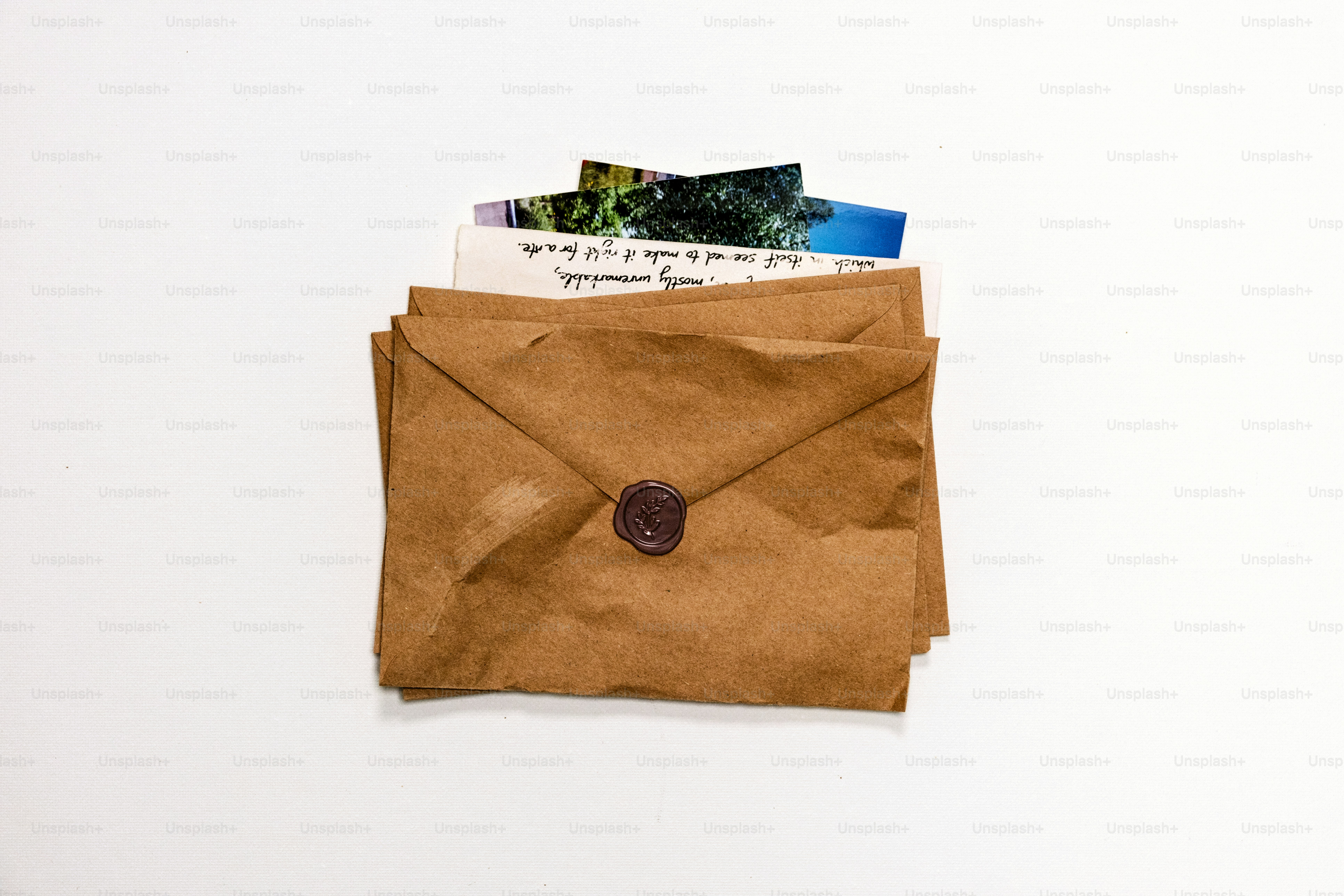 Three colorful envelopes with wax seals on white background photo ...