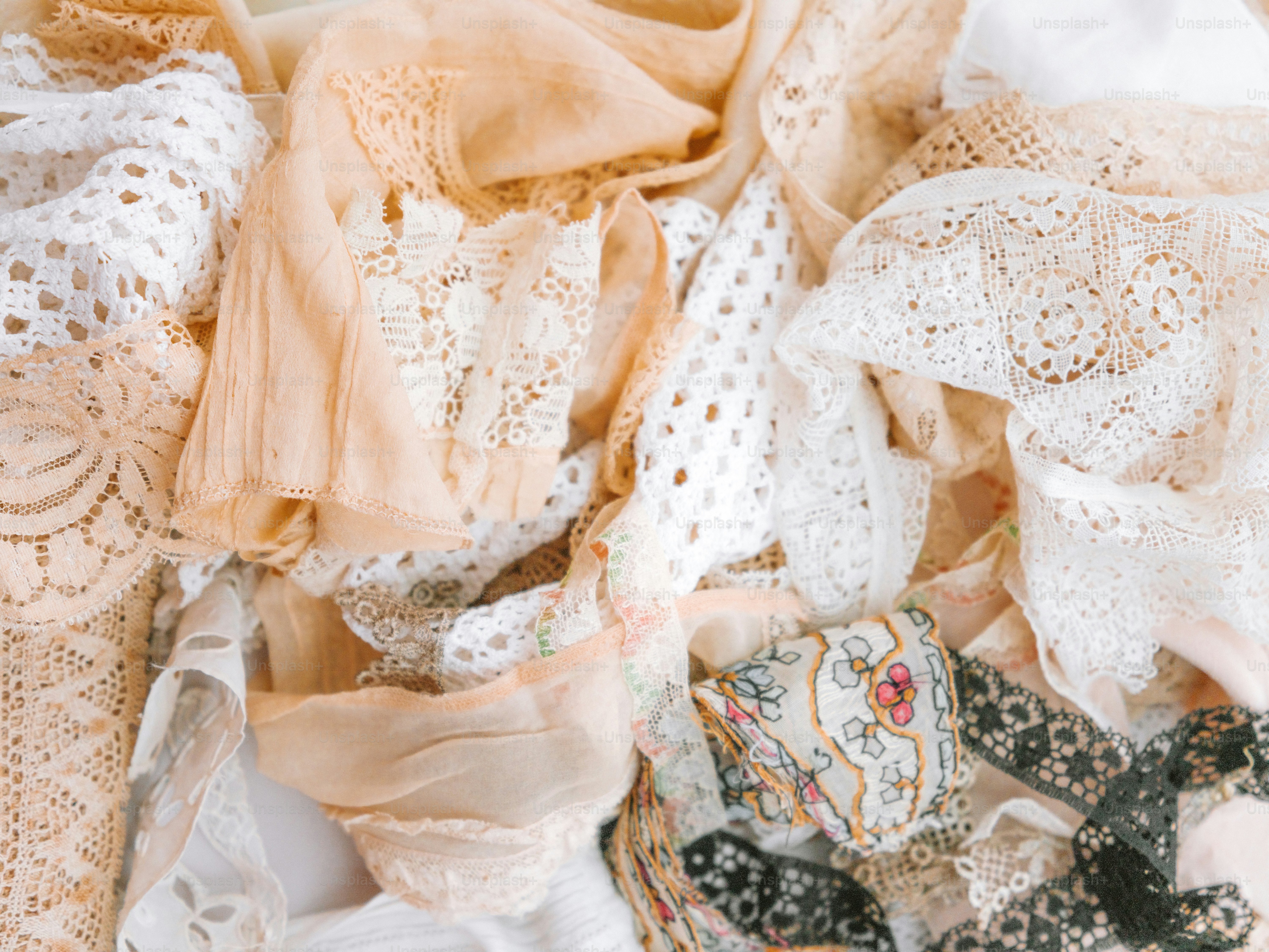 Pile of vintage lace and fabric scraps photo – Sewing Image on Unsplash