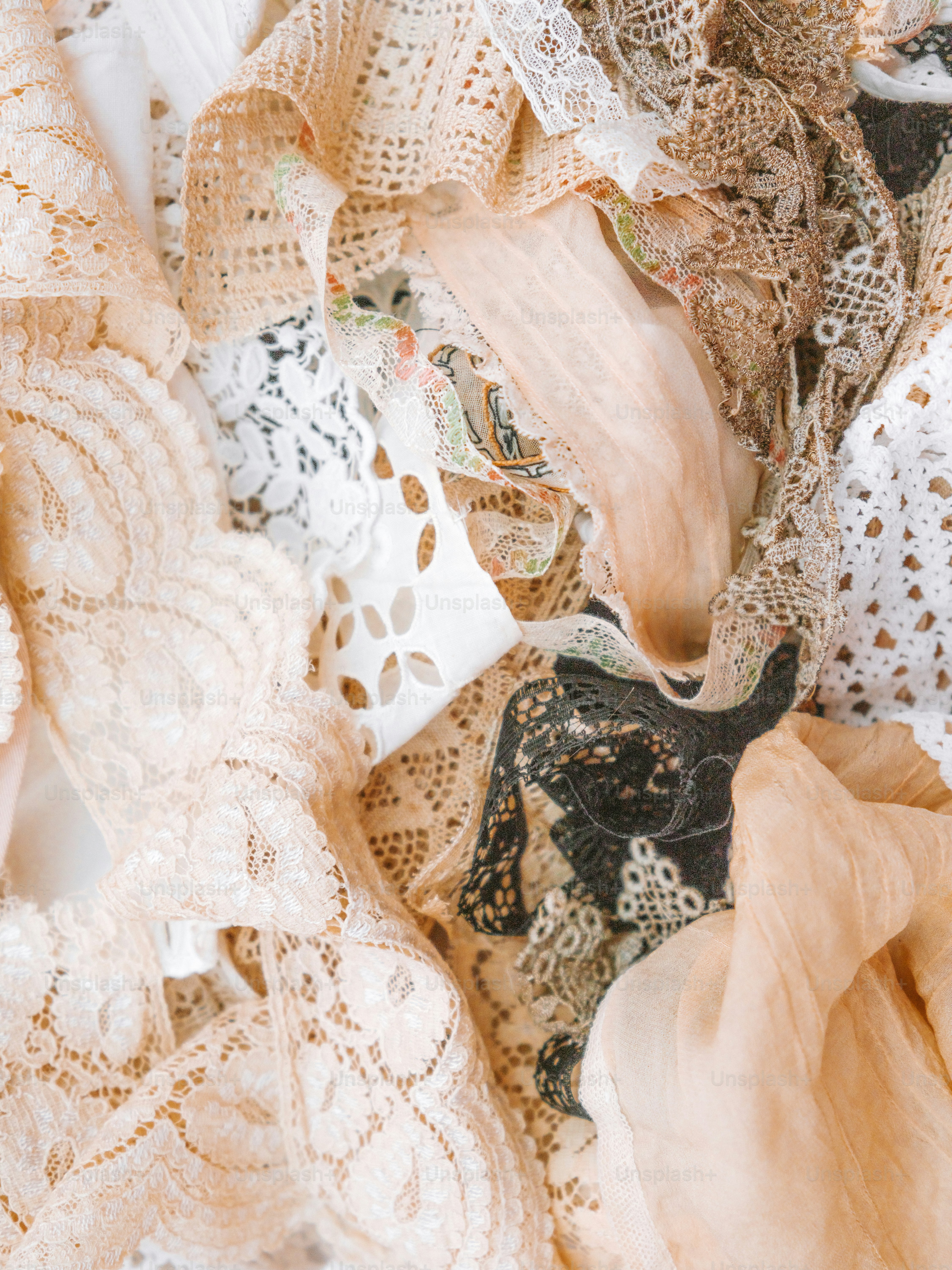 Pile of vintage lace and fabric scraps photo – Sewing Image on Unsplash