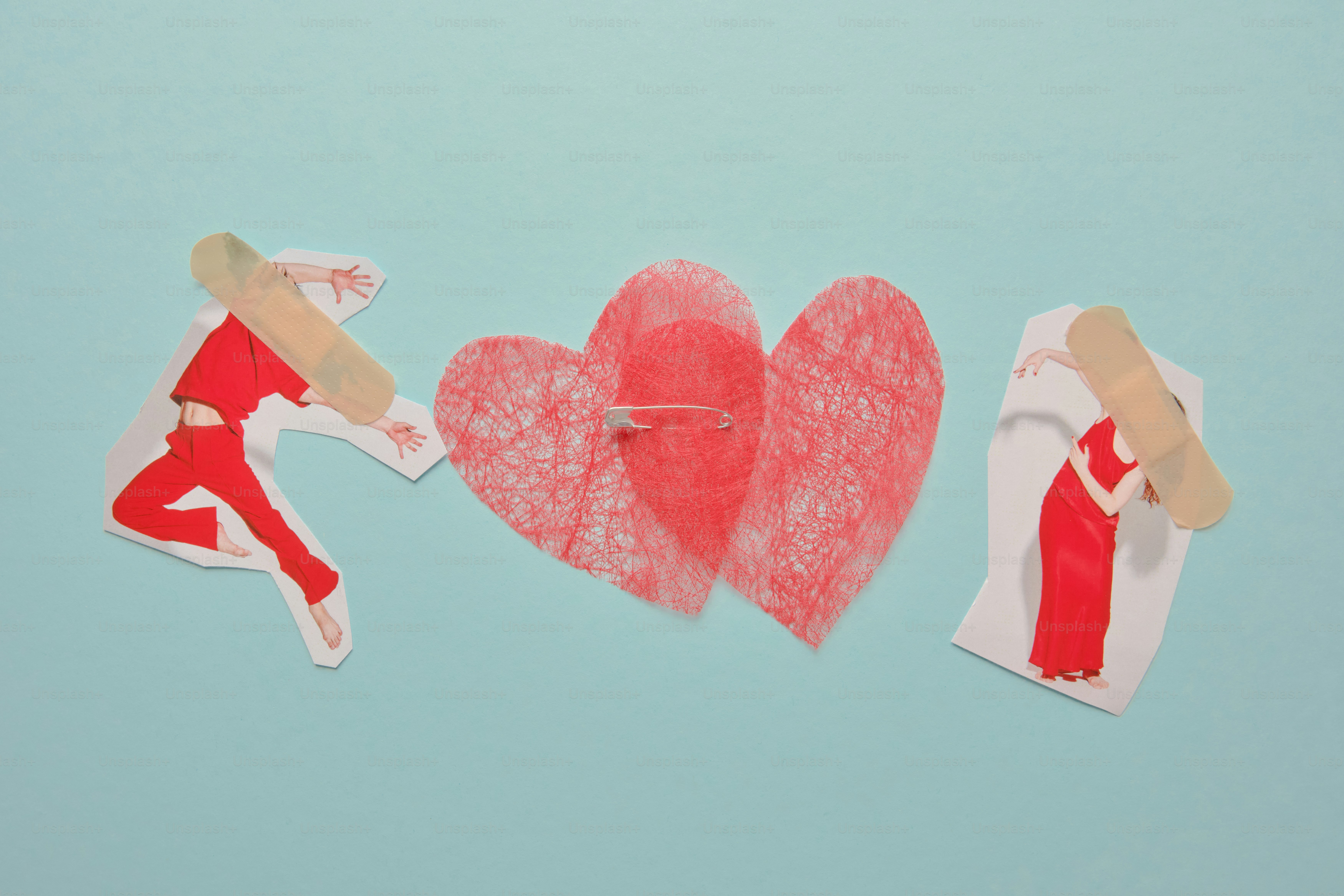 Two paper hearts with figures on band-aids photo – Love Image on Unsplash