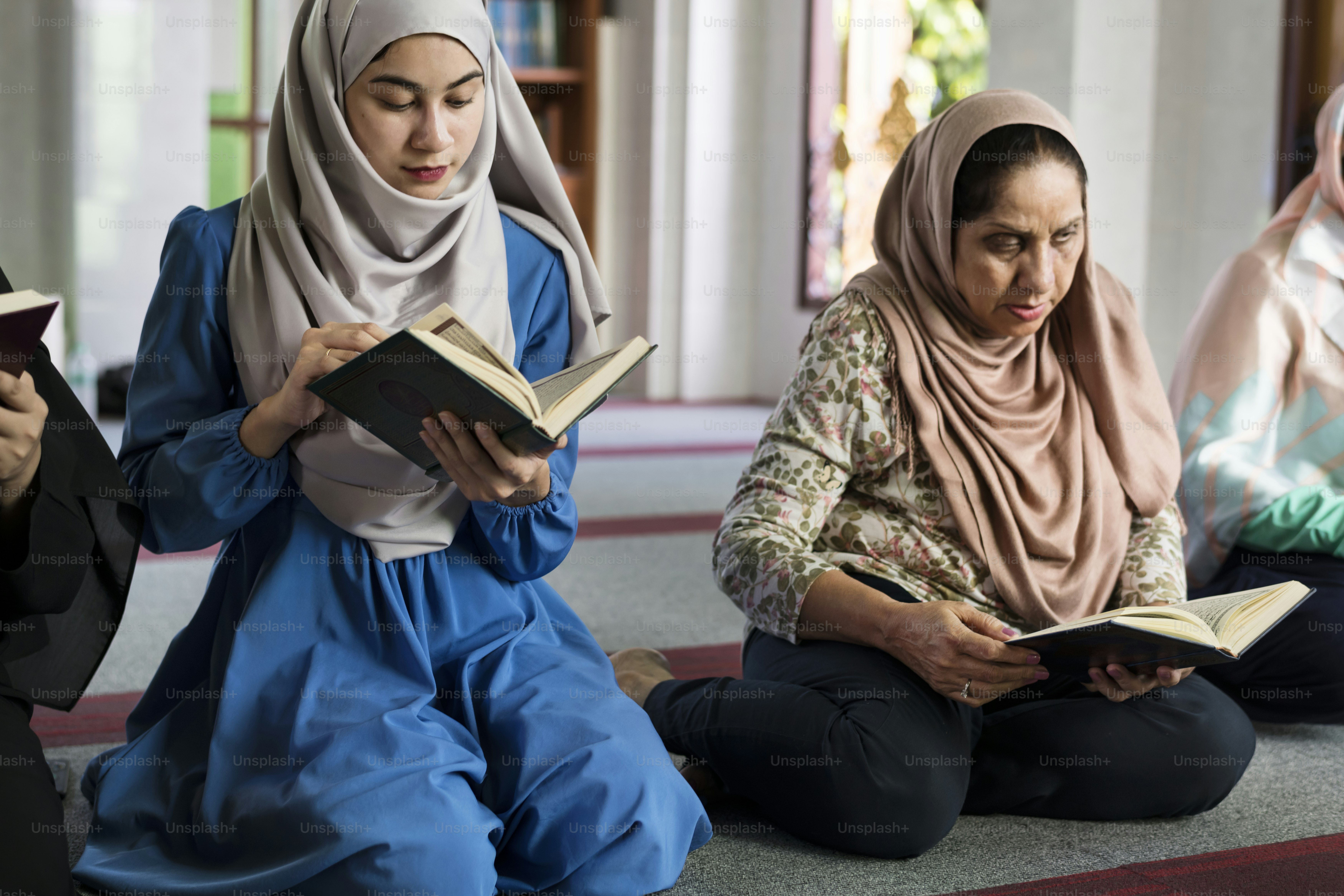 Muslim women reading Quran in the mosque during the Ramadan photo ...