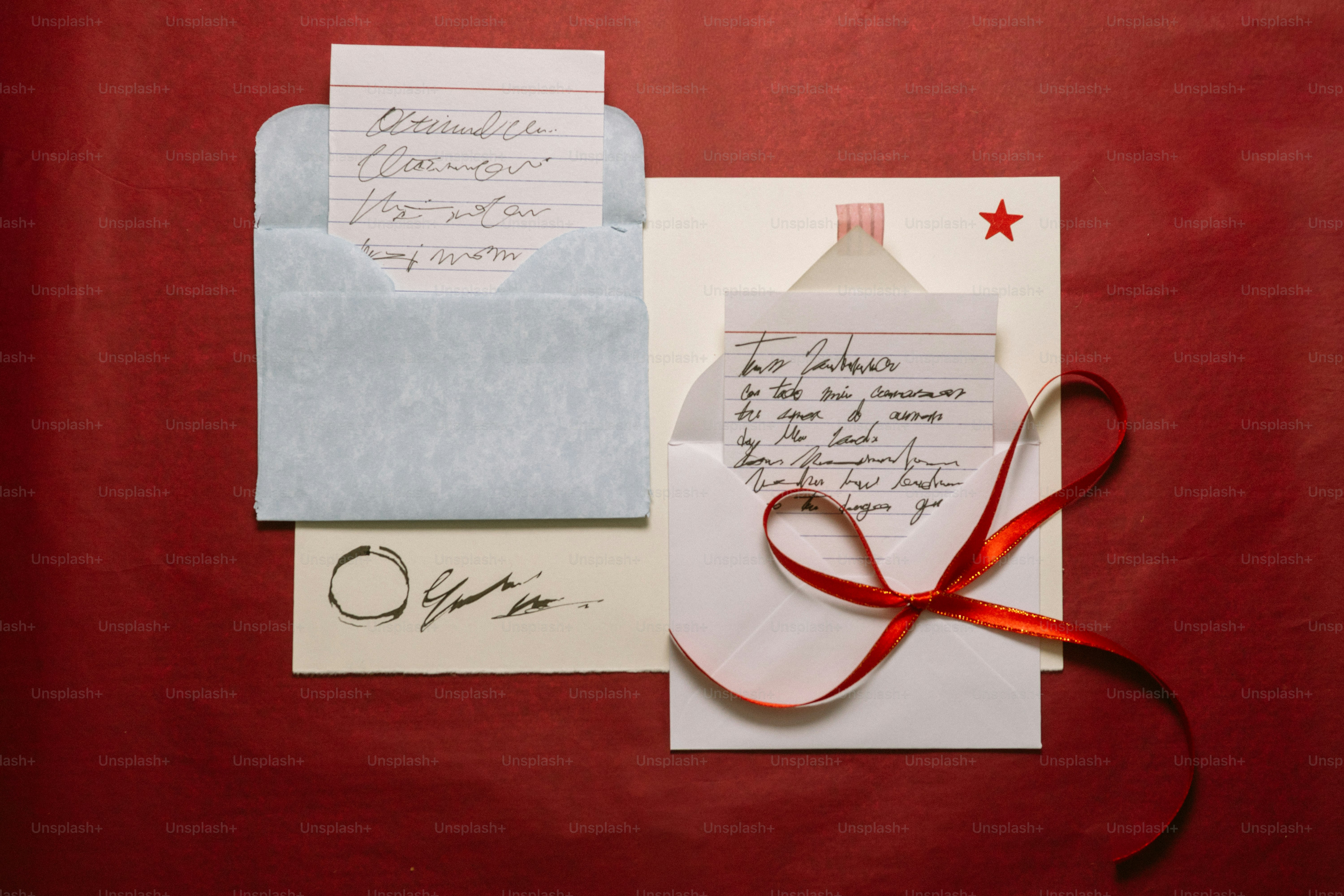 Handwritten notes in envelopes on red background. photo – Paper Image ...