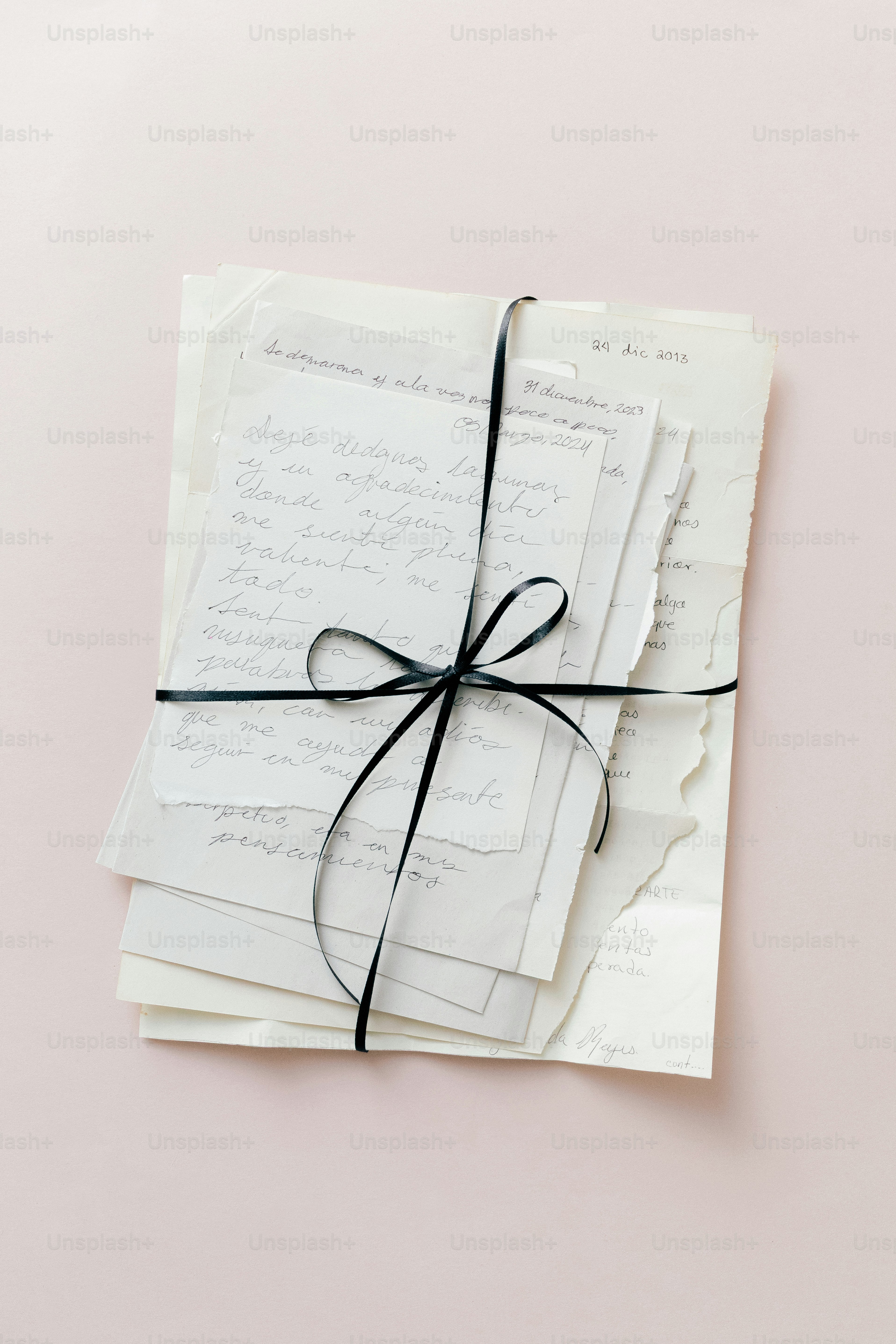 A stack of old, handwritten letters on pink background photo – Paper ...