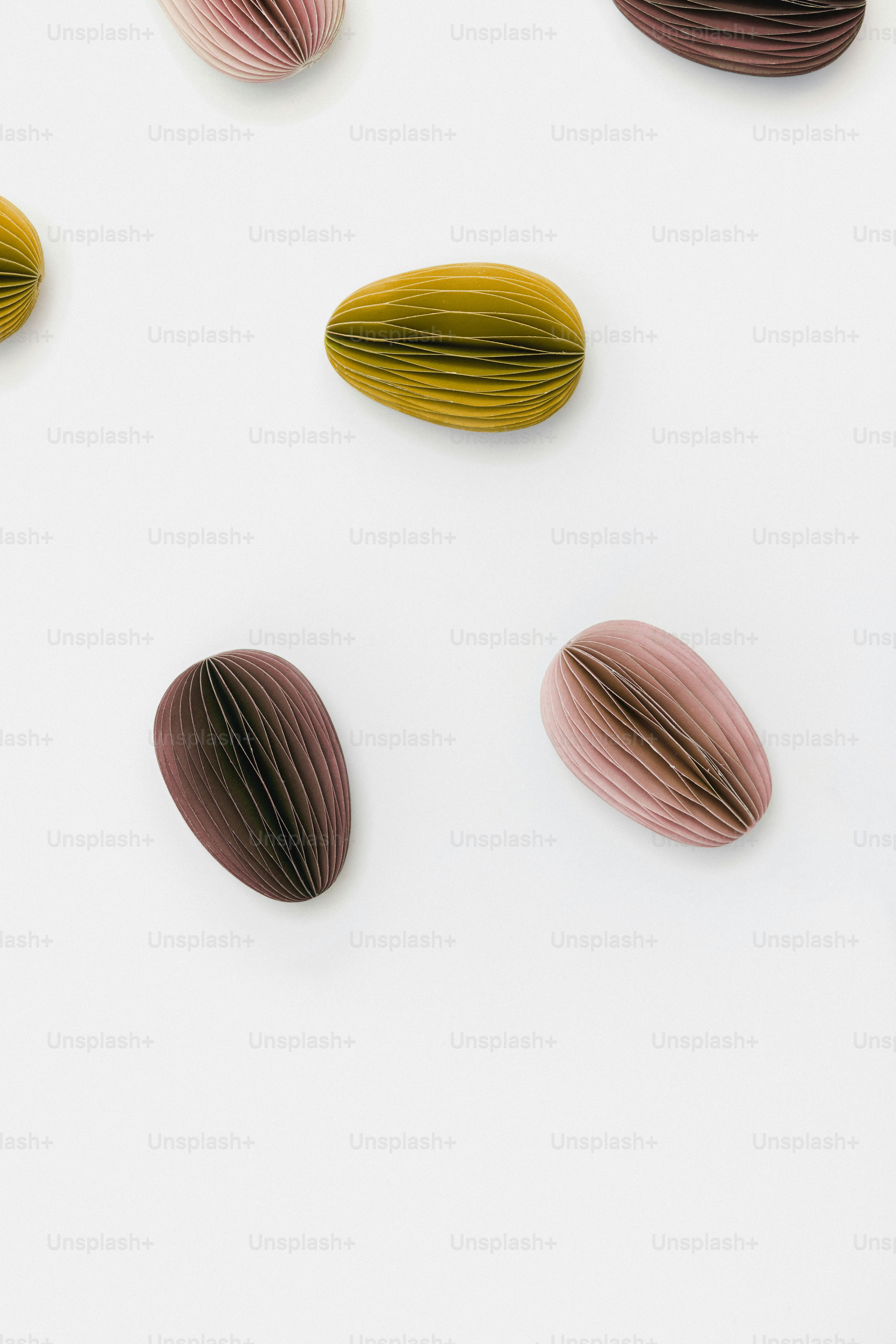 Several striped oval objects on a white background. photo – Minimalist ...