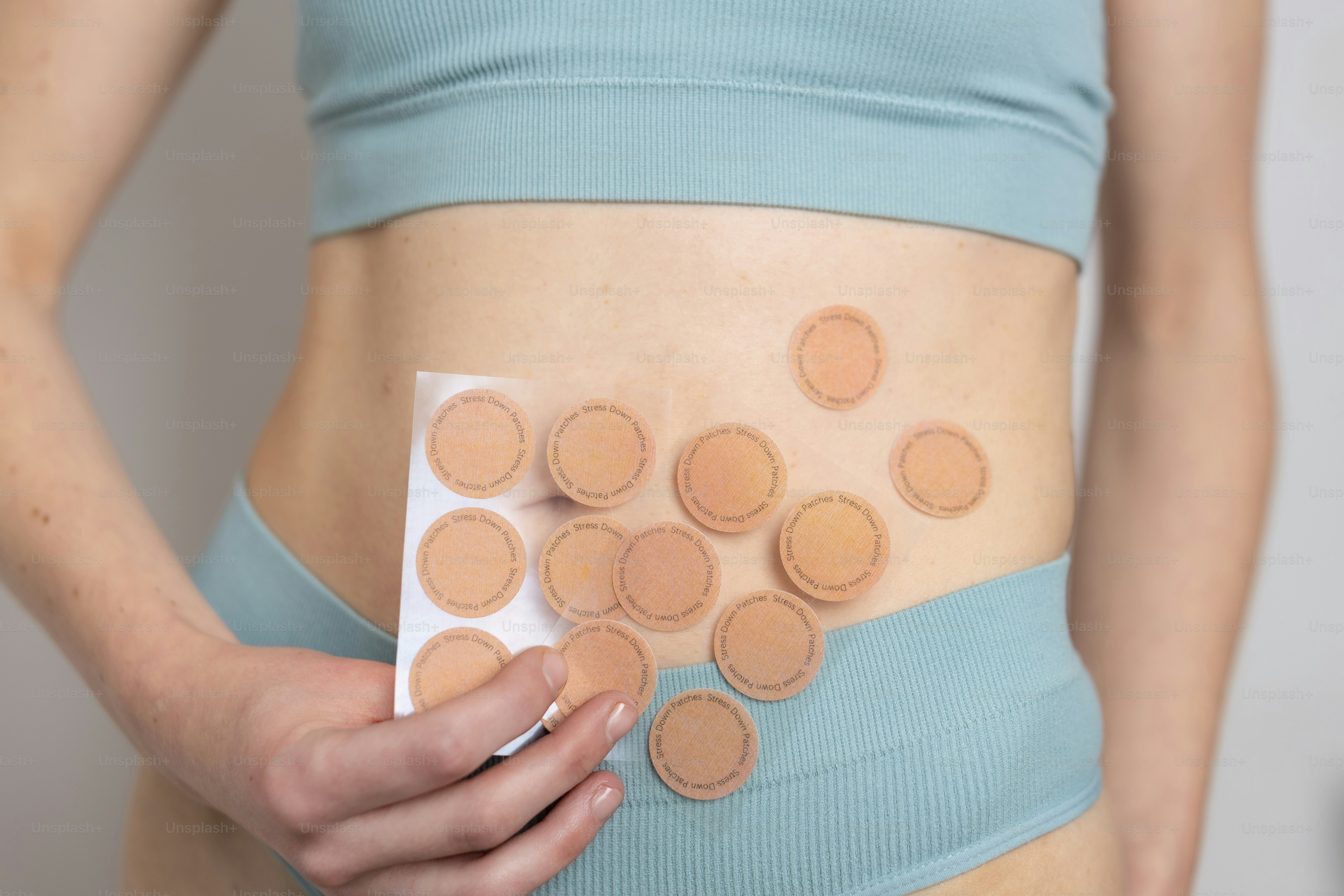 Woman with yellow patches on her abdomen photo – Health Image on Unsplash