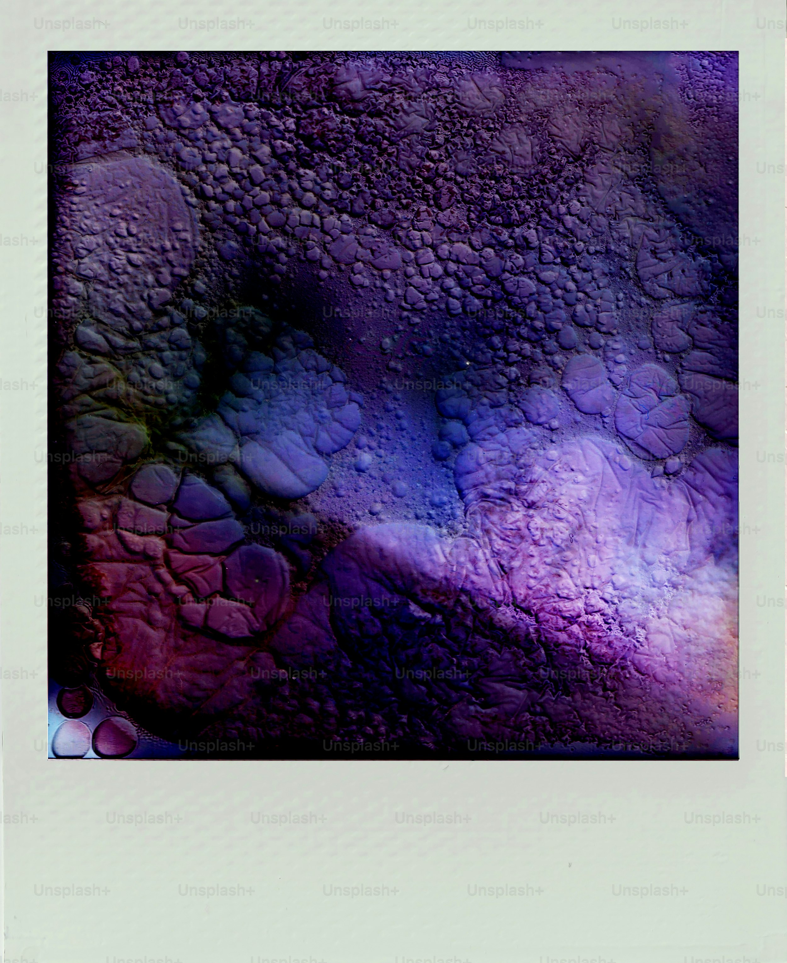 Abstract purple and blue textured surface with bubbly patterns. photo ...