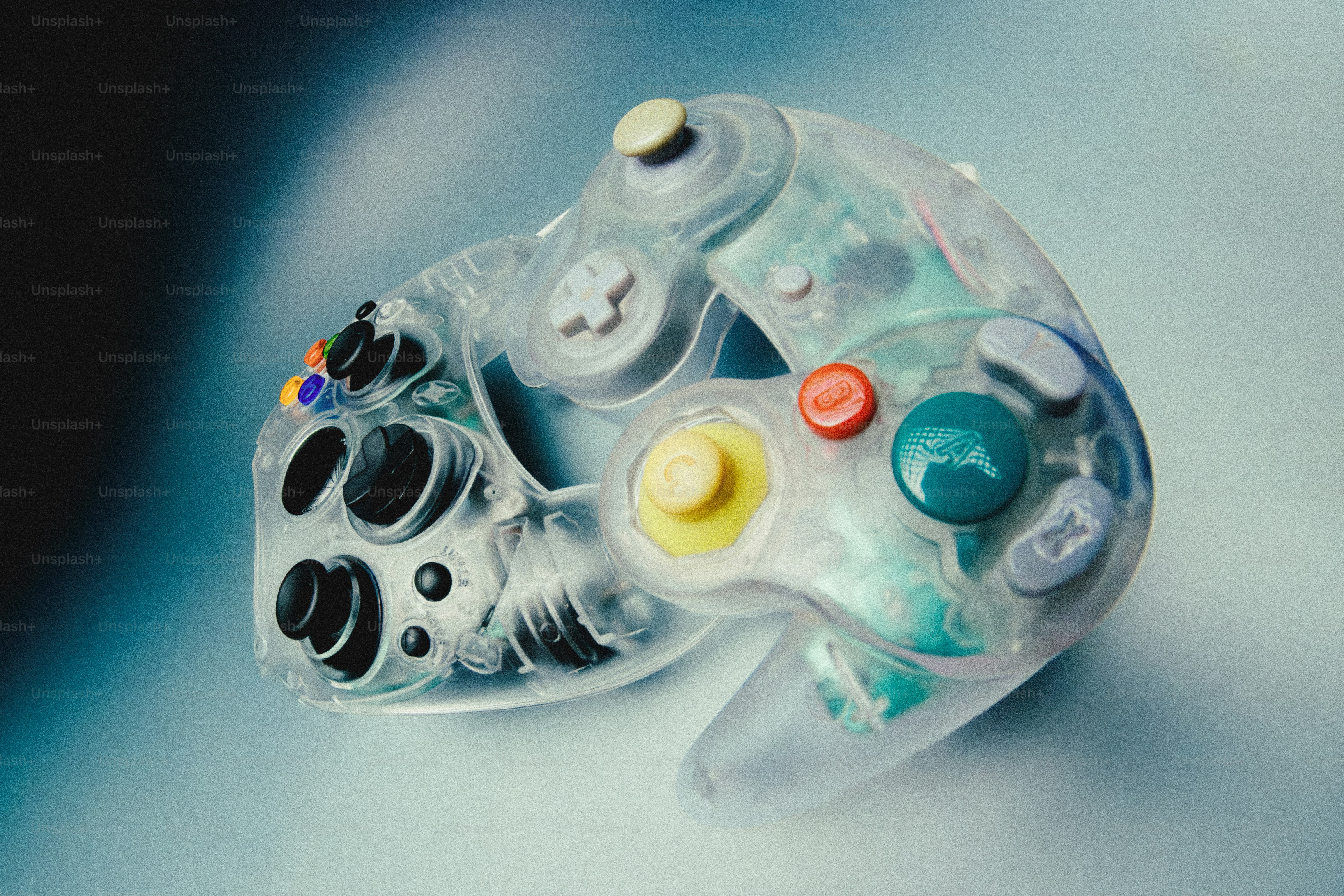 Two transparent video game controllers close-up controllers photo ...