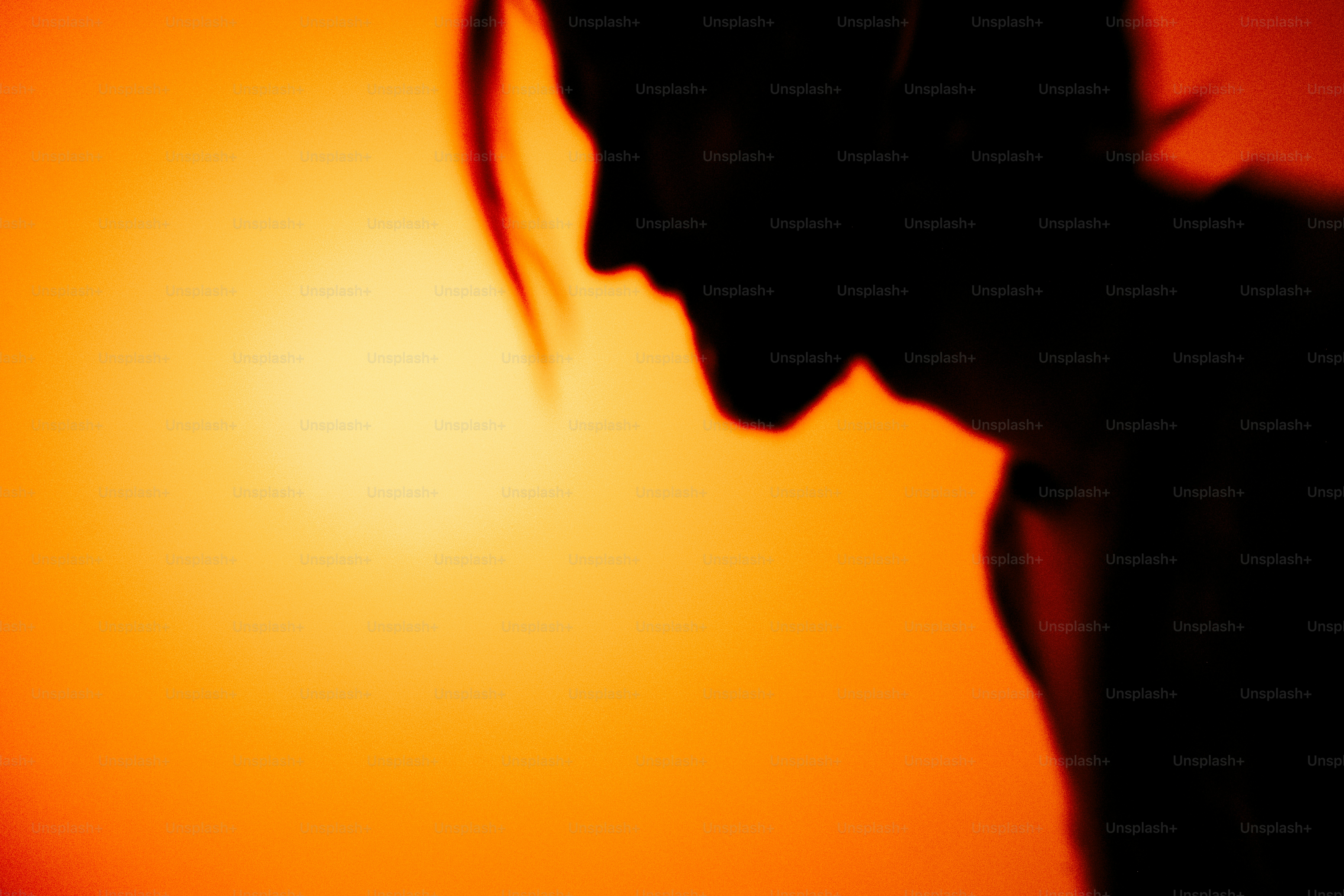 Blurred figure dancing against an orange background photo – Abstract ...