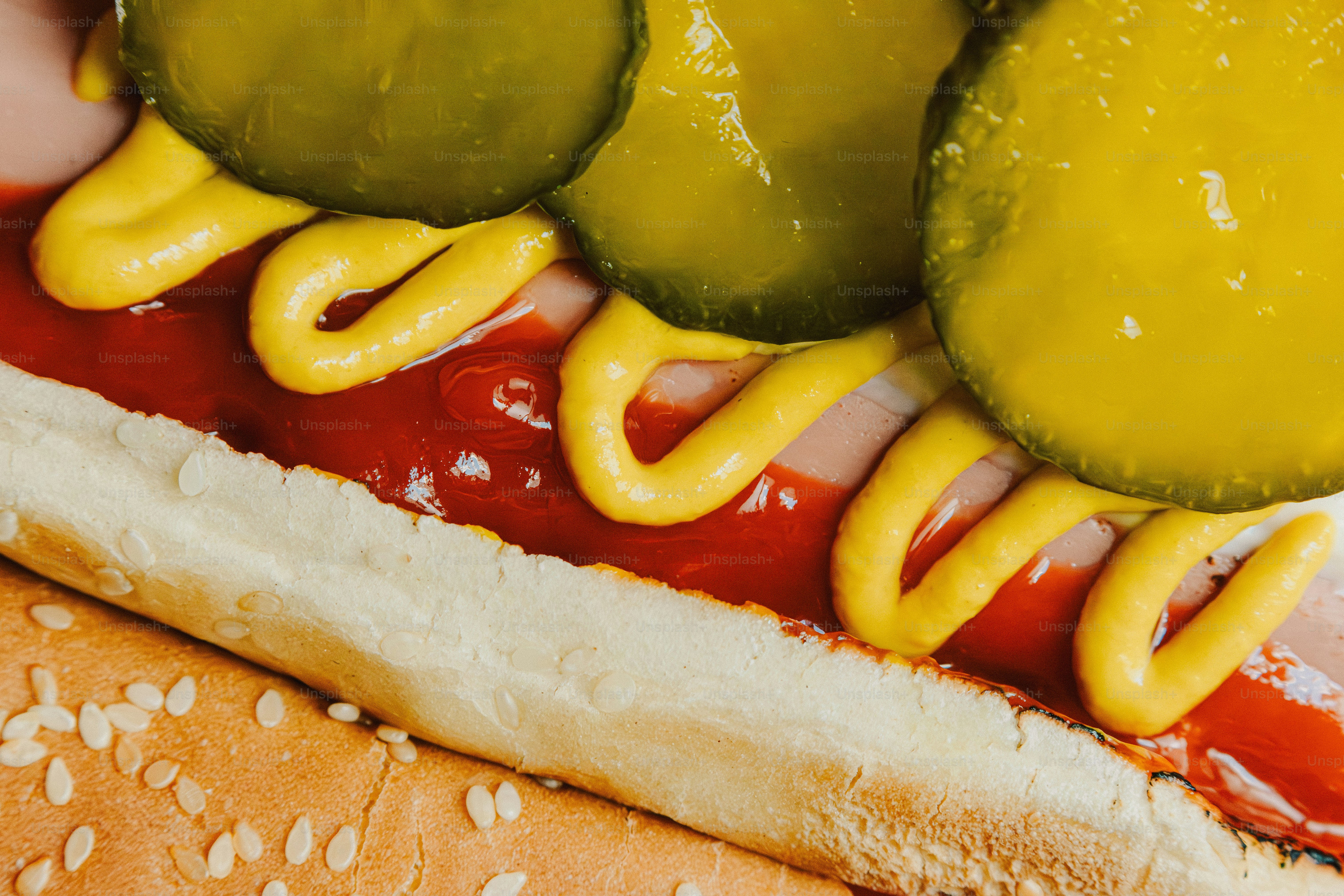 Hot dog with ketchup, mustard, and pickles photo – Food Image on Unsplash