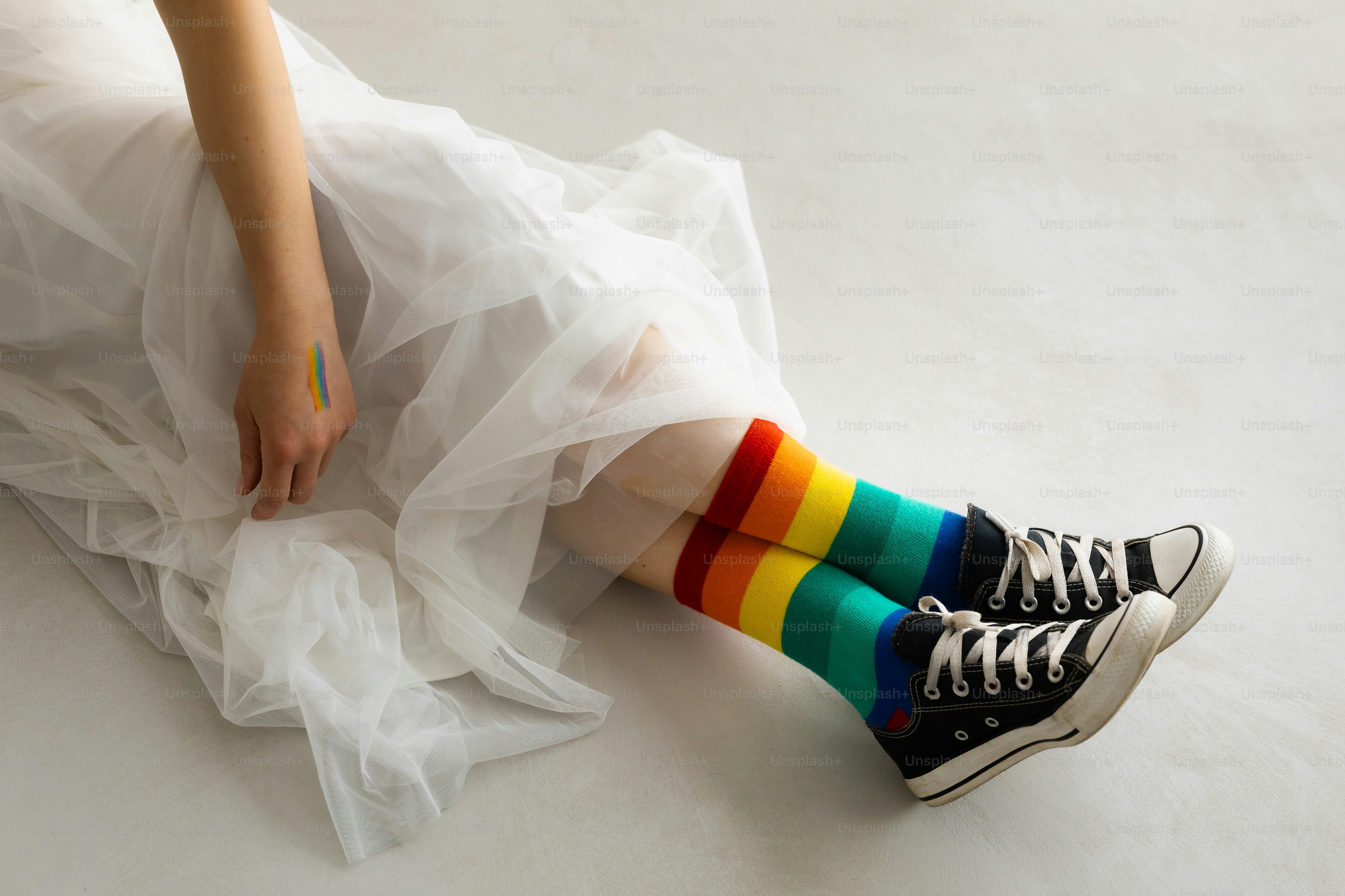 Person wearing rainbow flip-flops with painted hand photo – Love Image ...