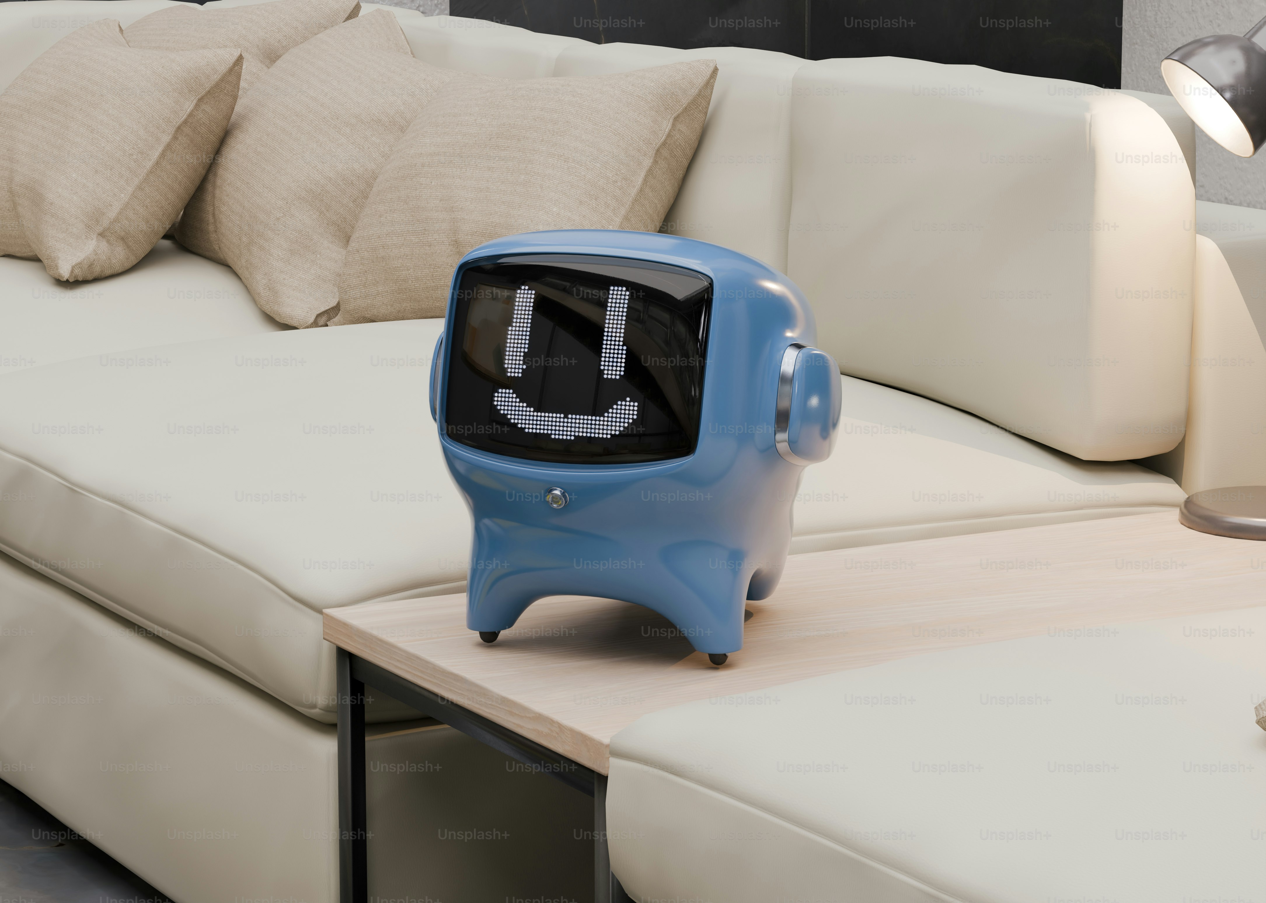 Small blue robot displays happy face on table. photo – Technology Image ...