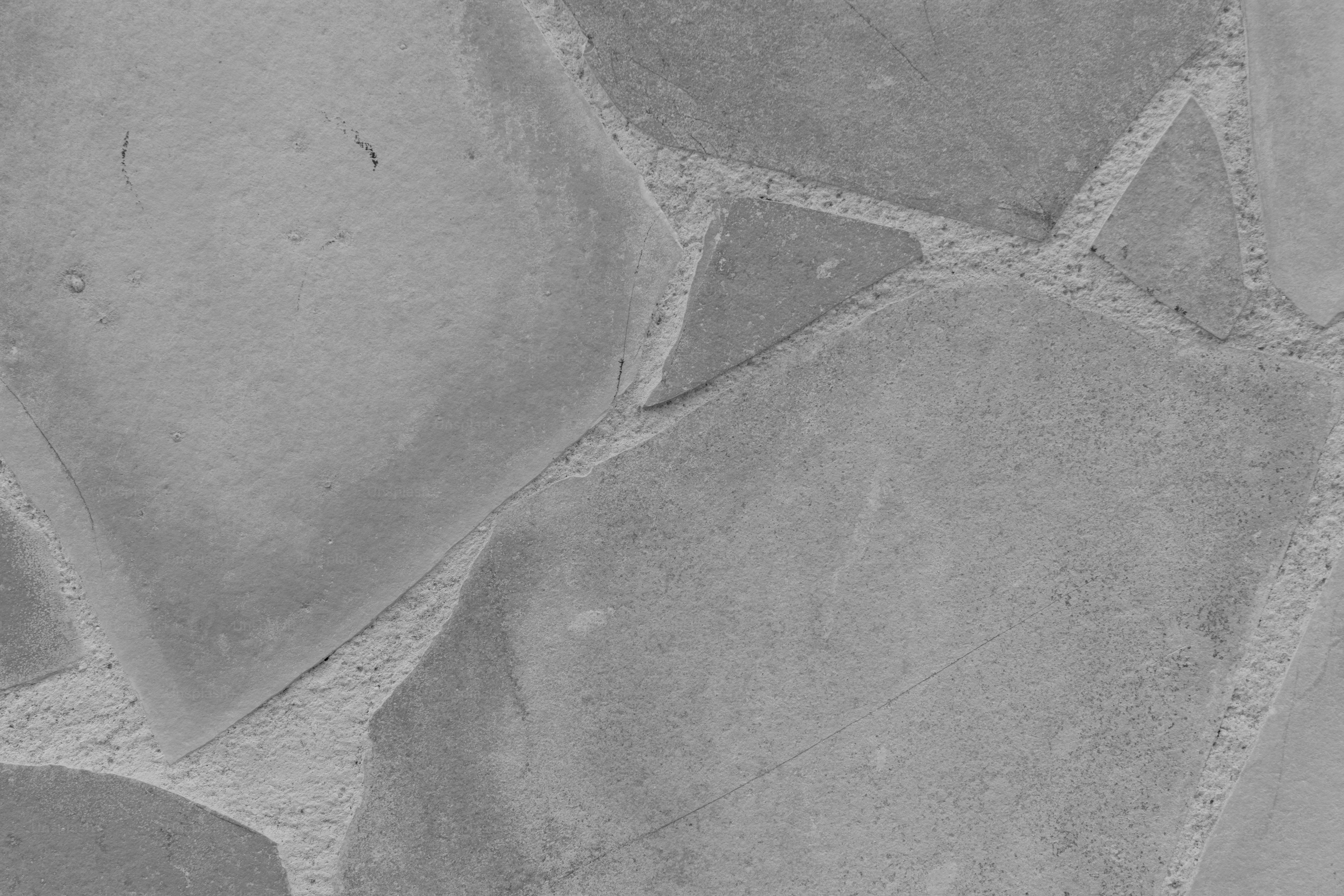 Gray irregular stone pavement with visible grout lines. photo – Texture ...