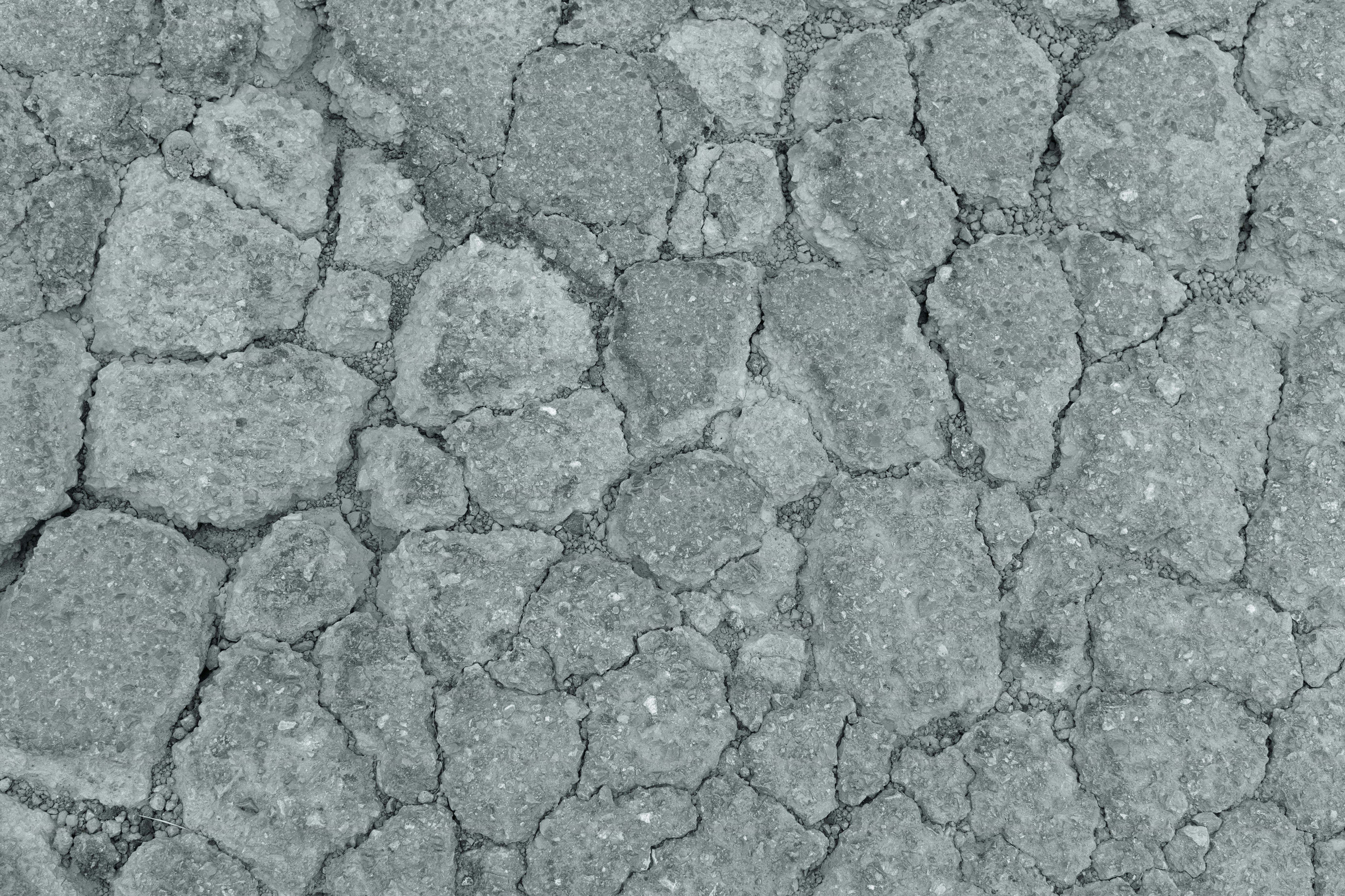 Rough, cracked grey surface texture. photo – Texture Image on Unsplash