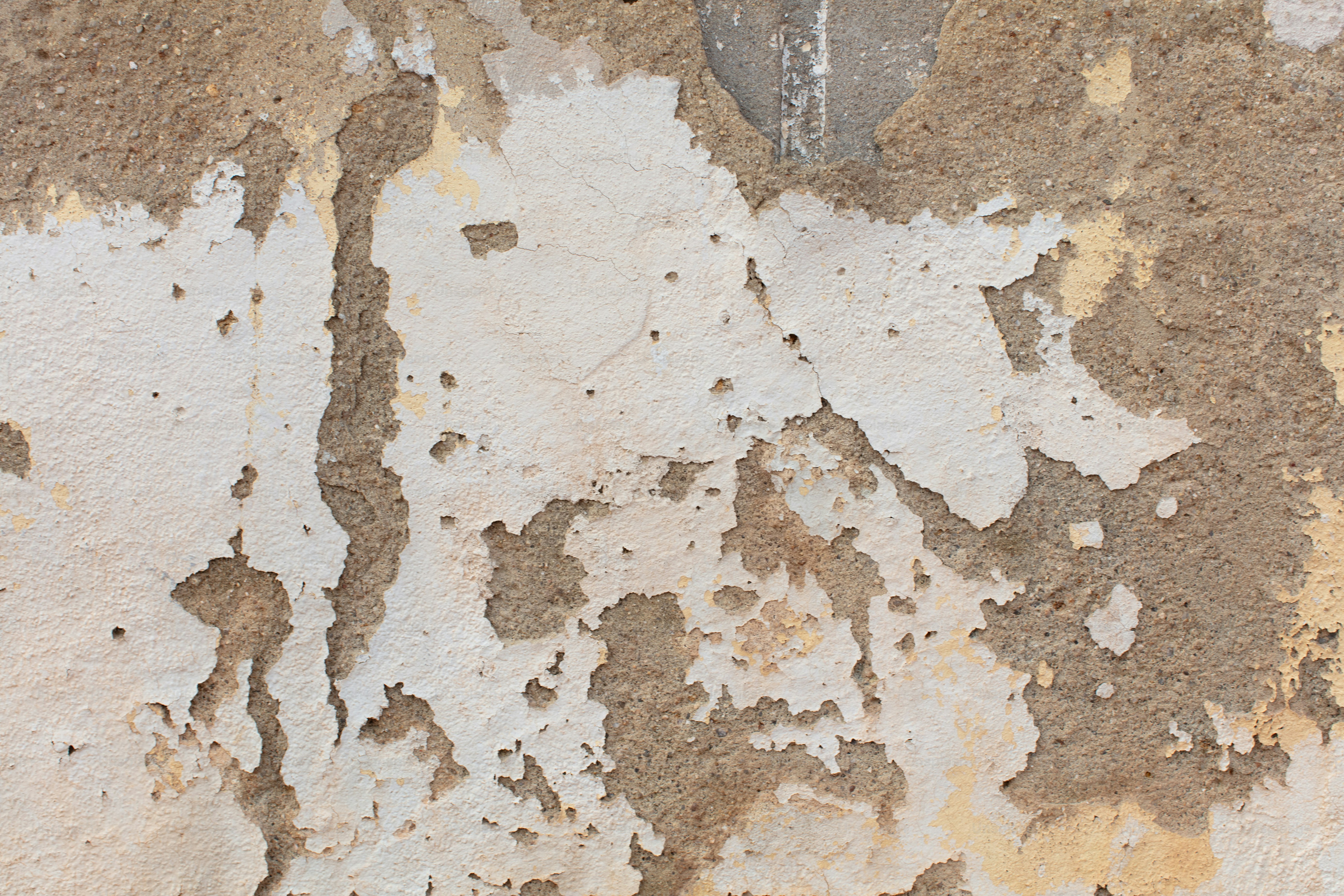 Rough concrete wall with peeling blue and white paper texture. photo ...