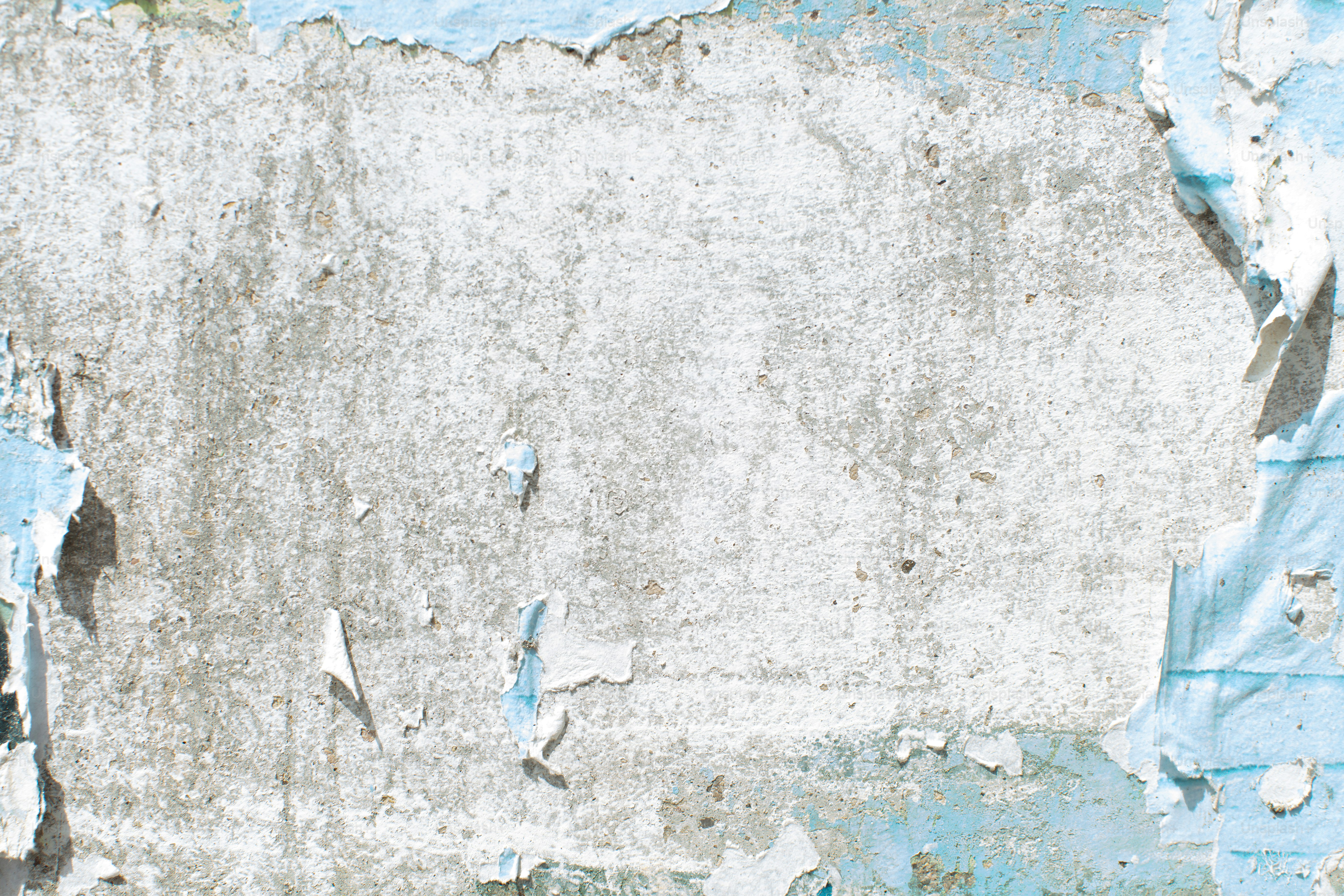 Rough concrete wall with peeling blue and white paper texture. photo ...